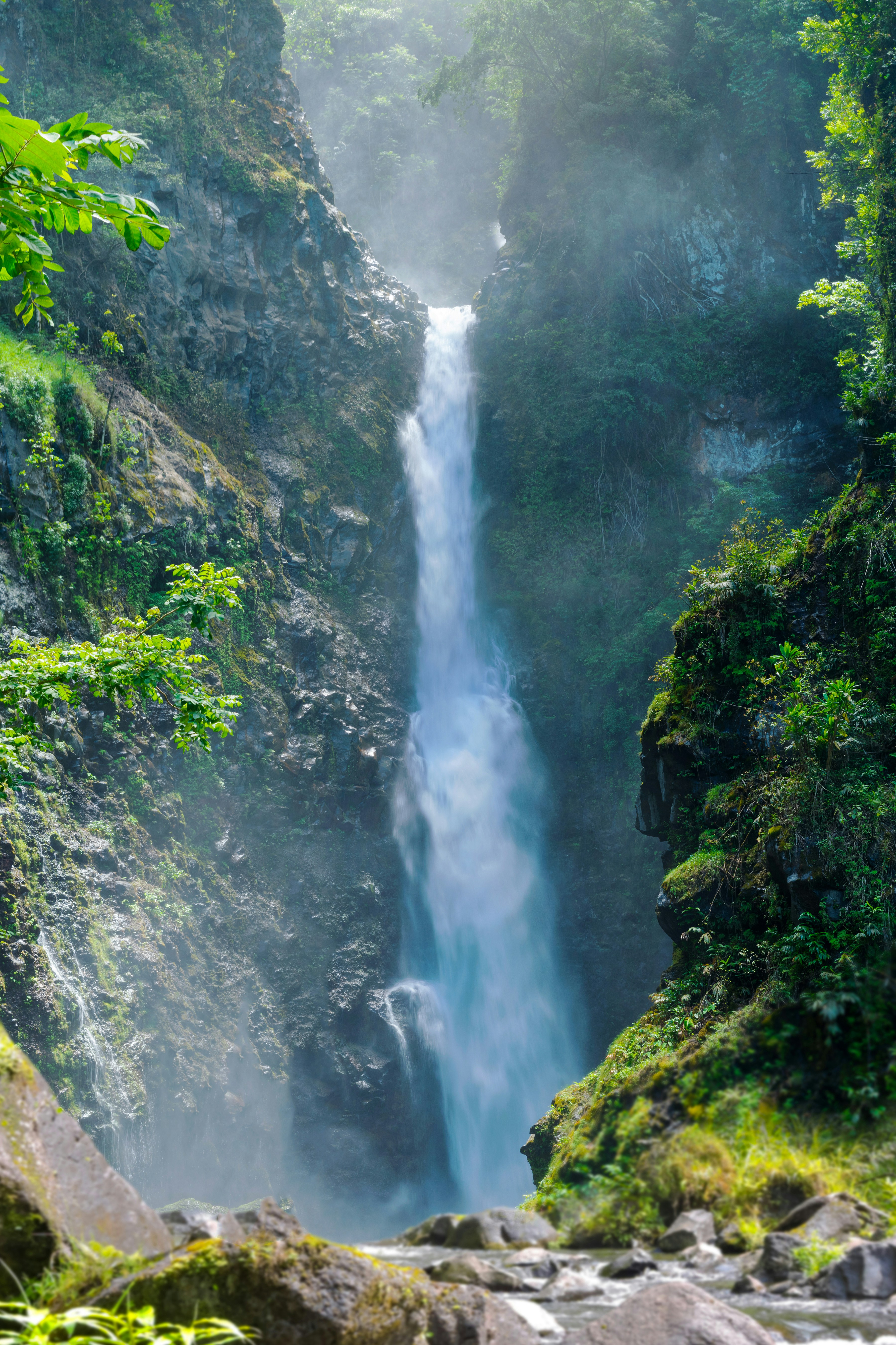 Cascading Veil: A Narrow Canyon Falls Carved by Mist