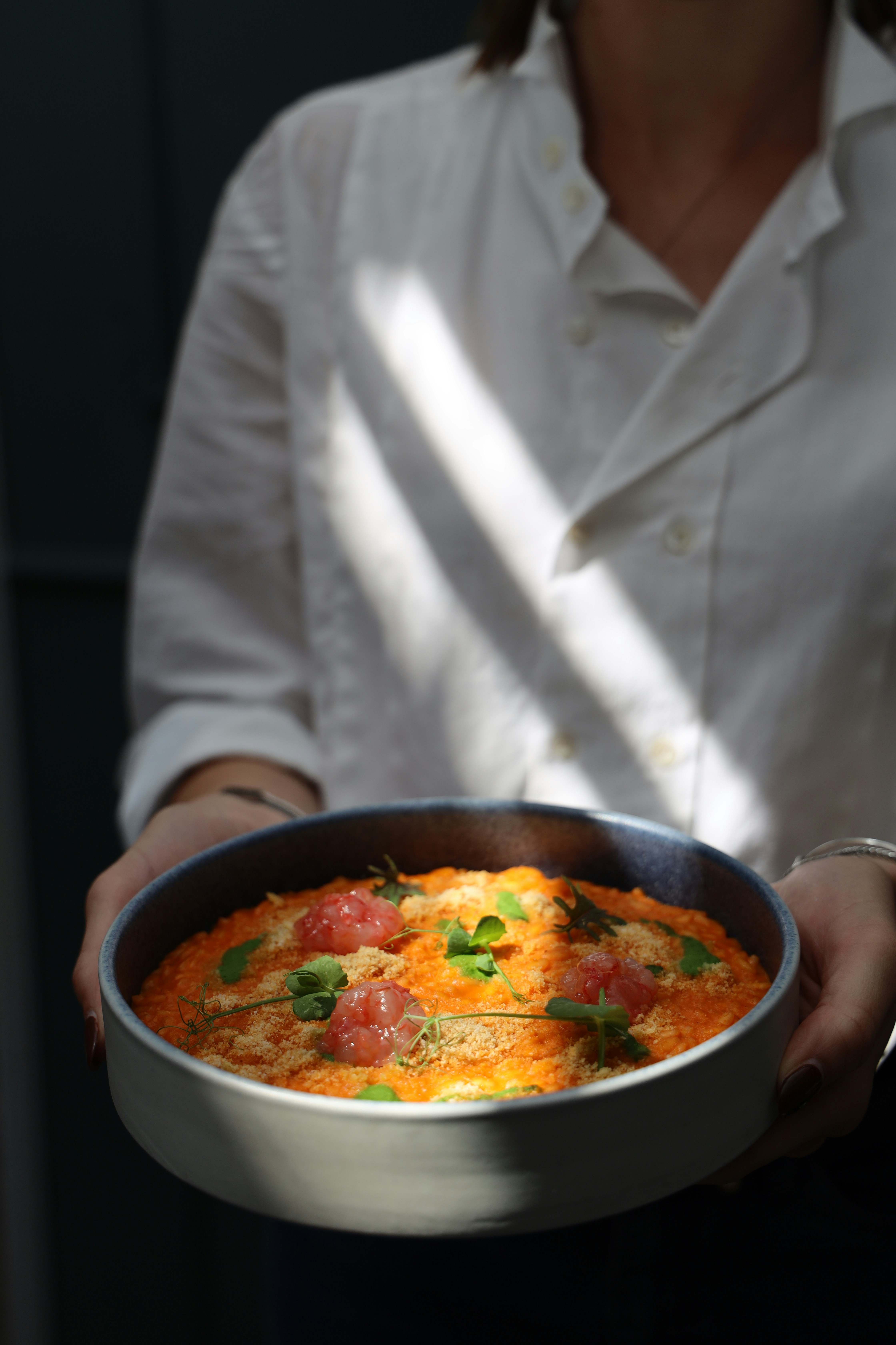 Culinary Spotlight: A Misty White Shirt Holds a Warm Dish