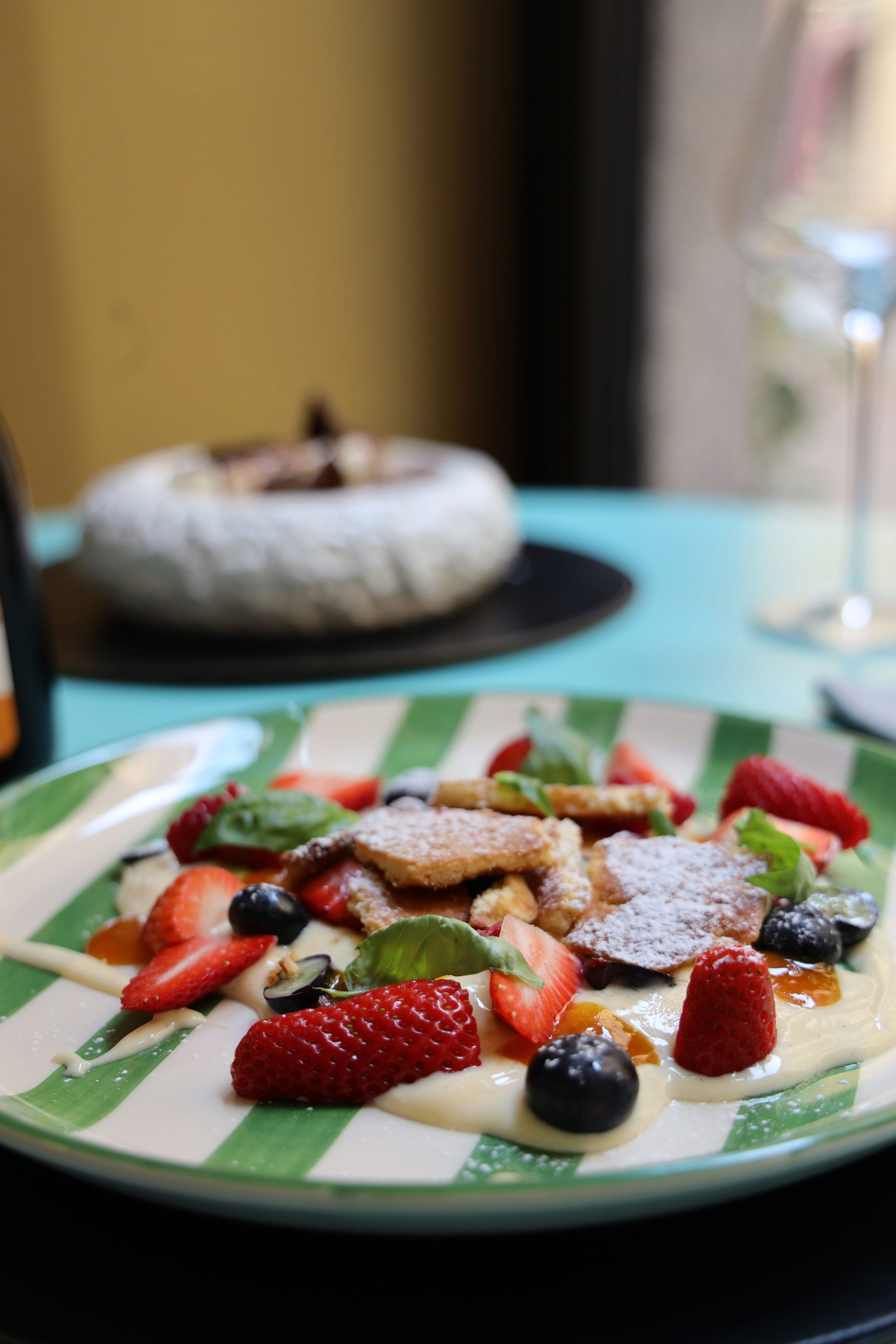 Strawberry-Blueberry Bliss with Crispy Garnish on Striped Plate