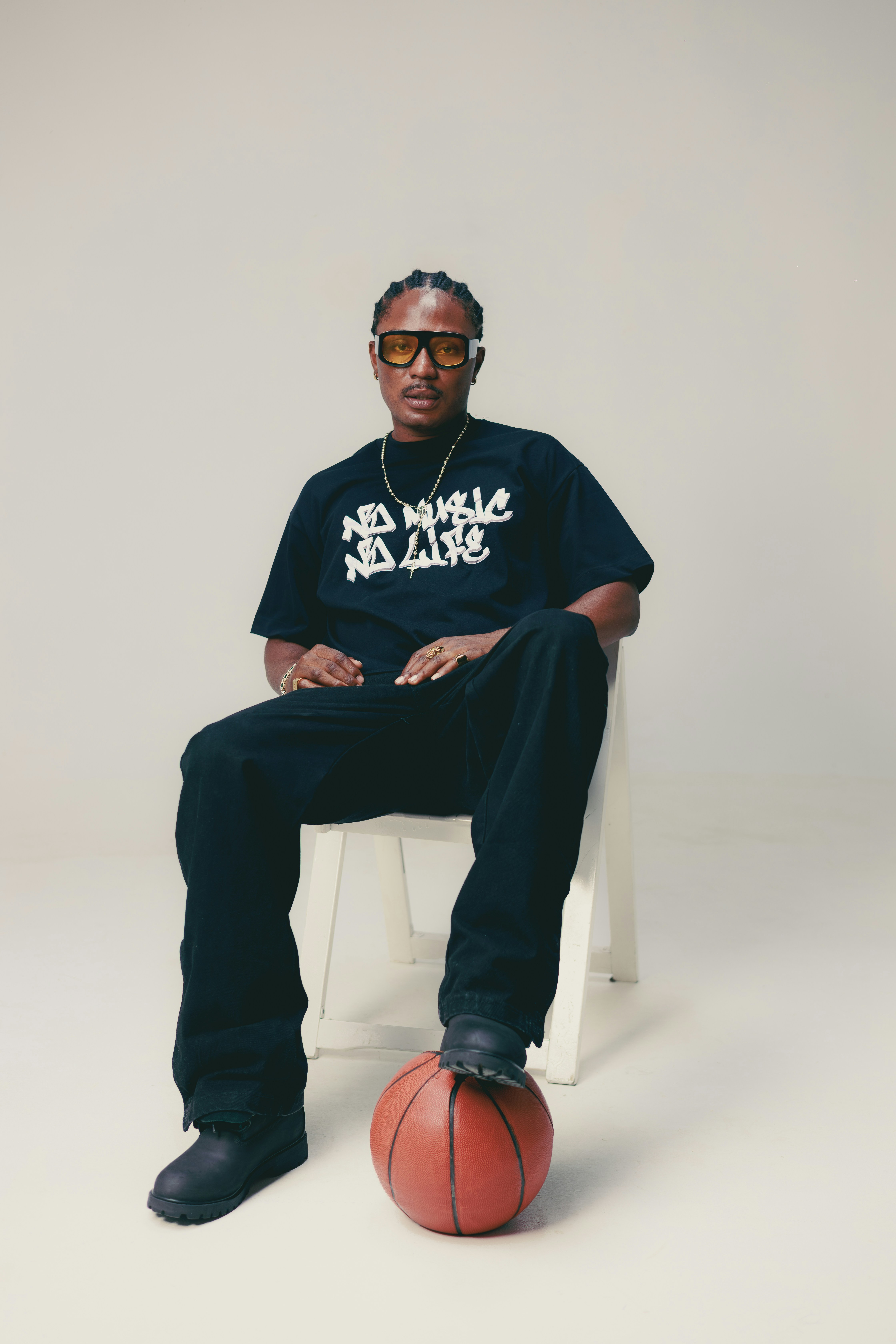 Quiet Confidence with a Basketball at Rest