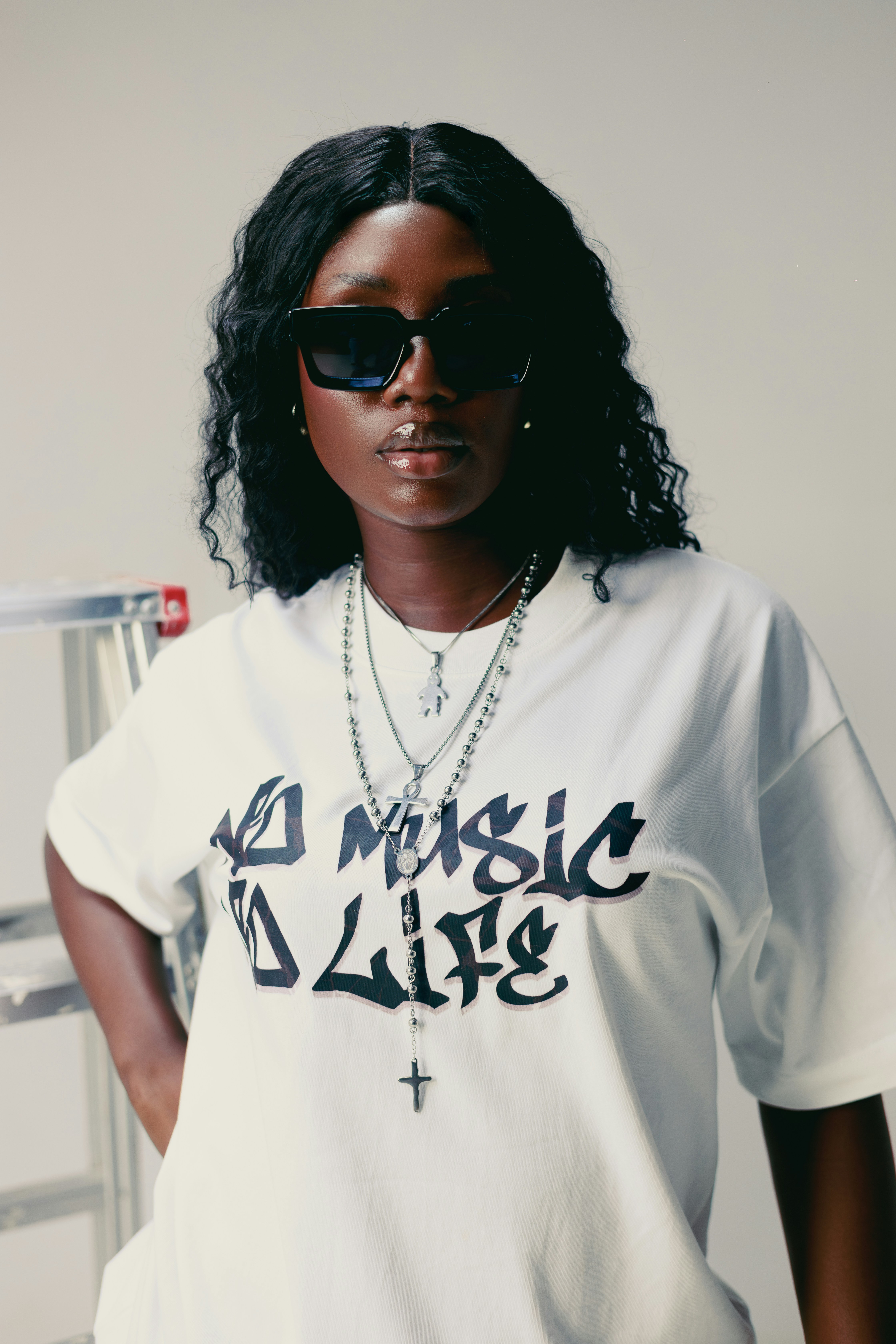 Shadowed Focus: Portrait in a White Tee with Dark Glasses