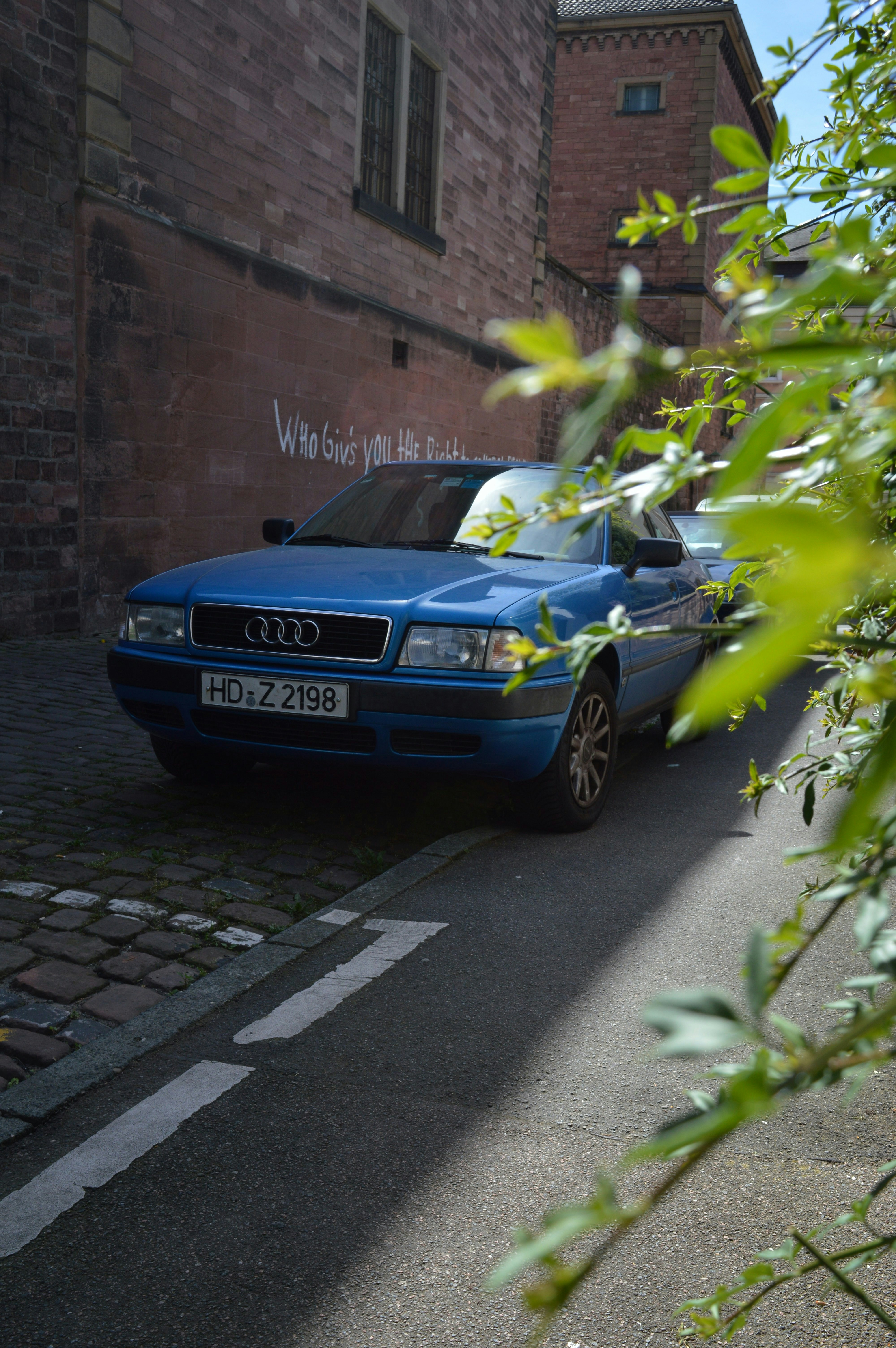 Blue Audi on a Narrow Street: Car at an Angle