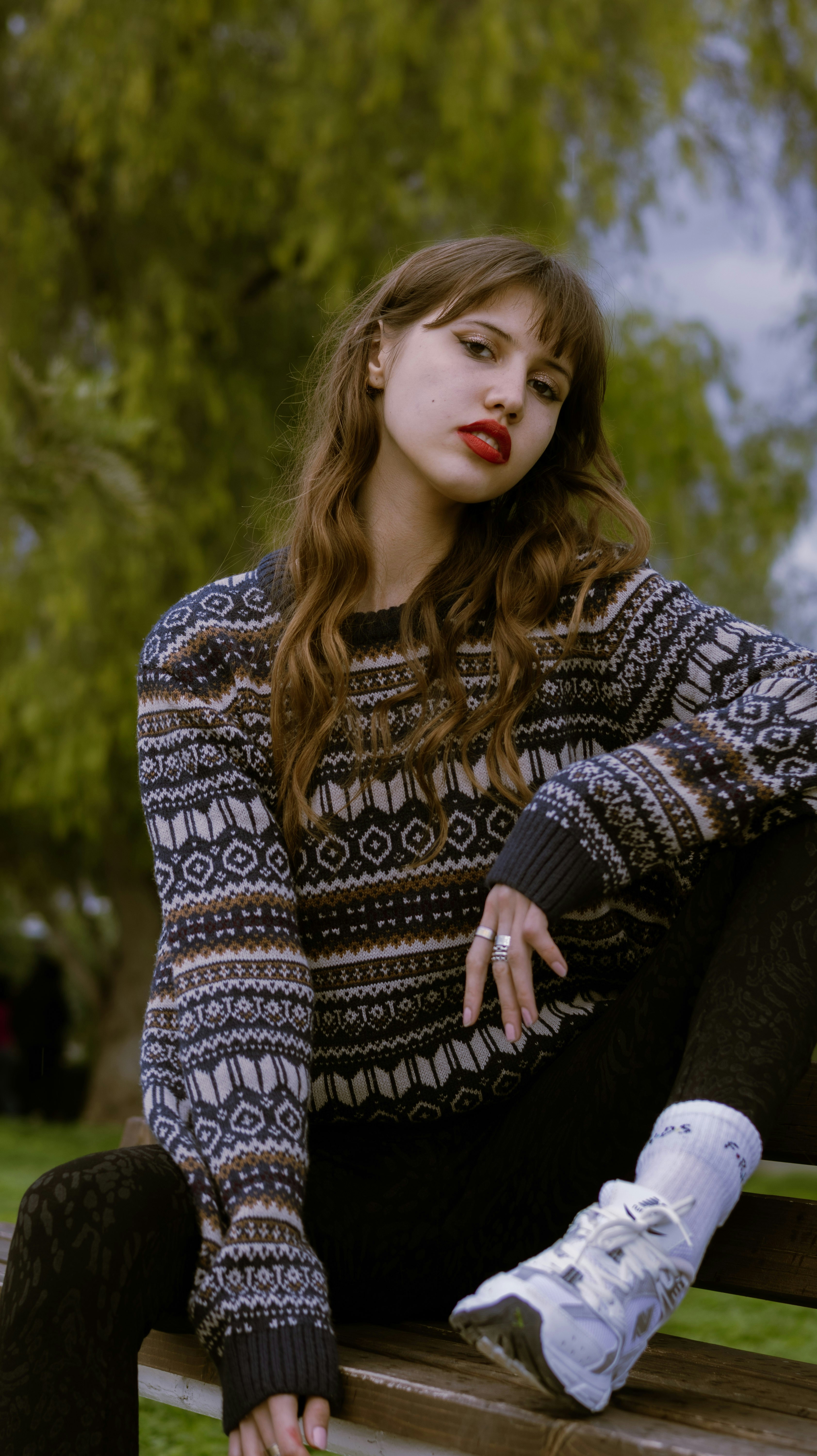 Poised in a Quiet Moment: Portrait on a Park Bench