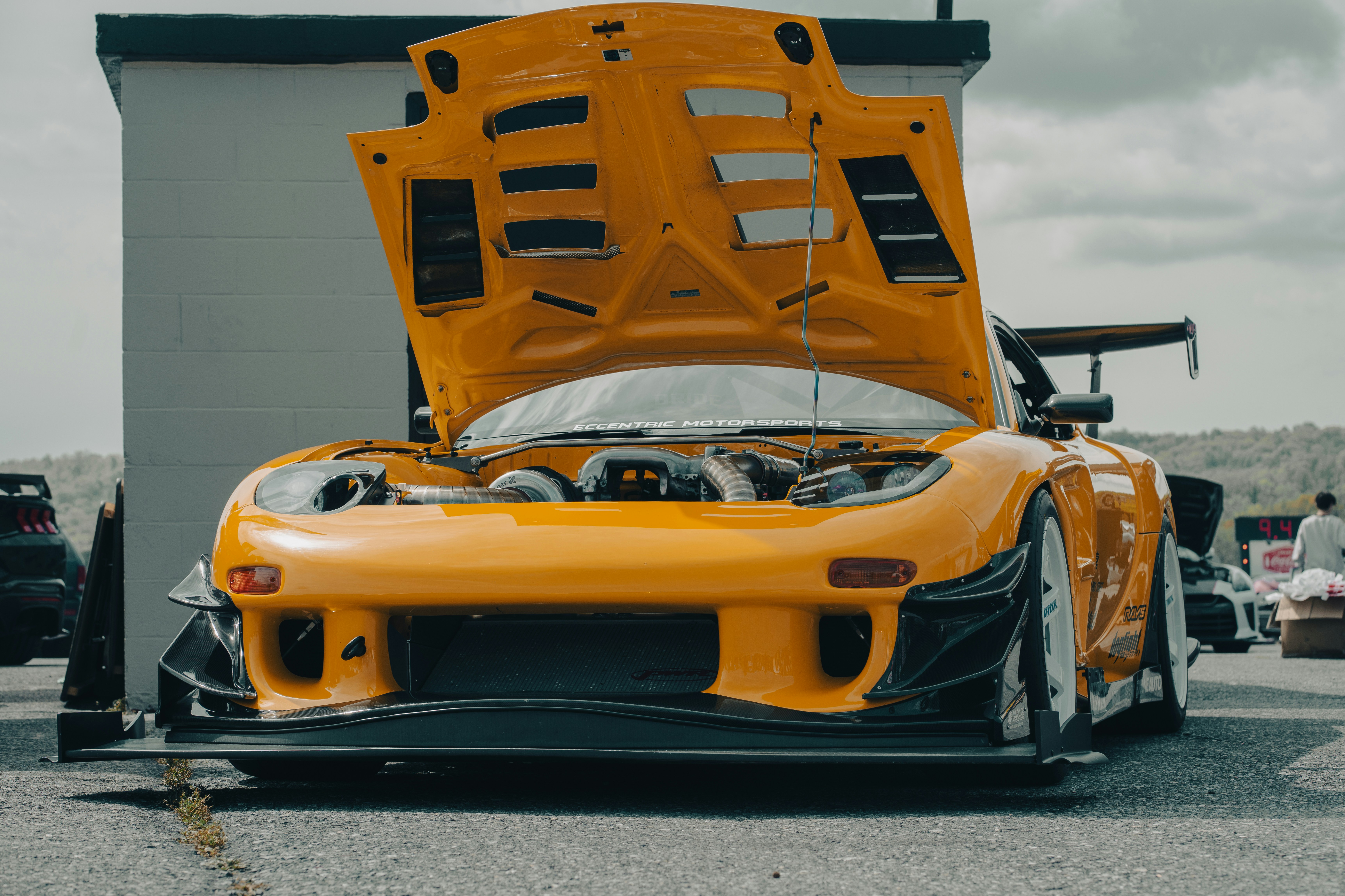 Orange Rage on the Tarmac: A Front-Loaded Race Machine