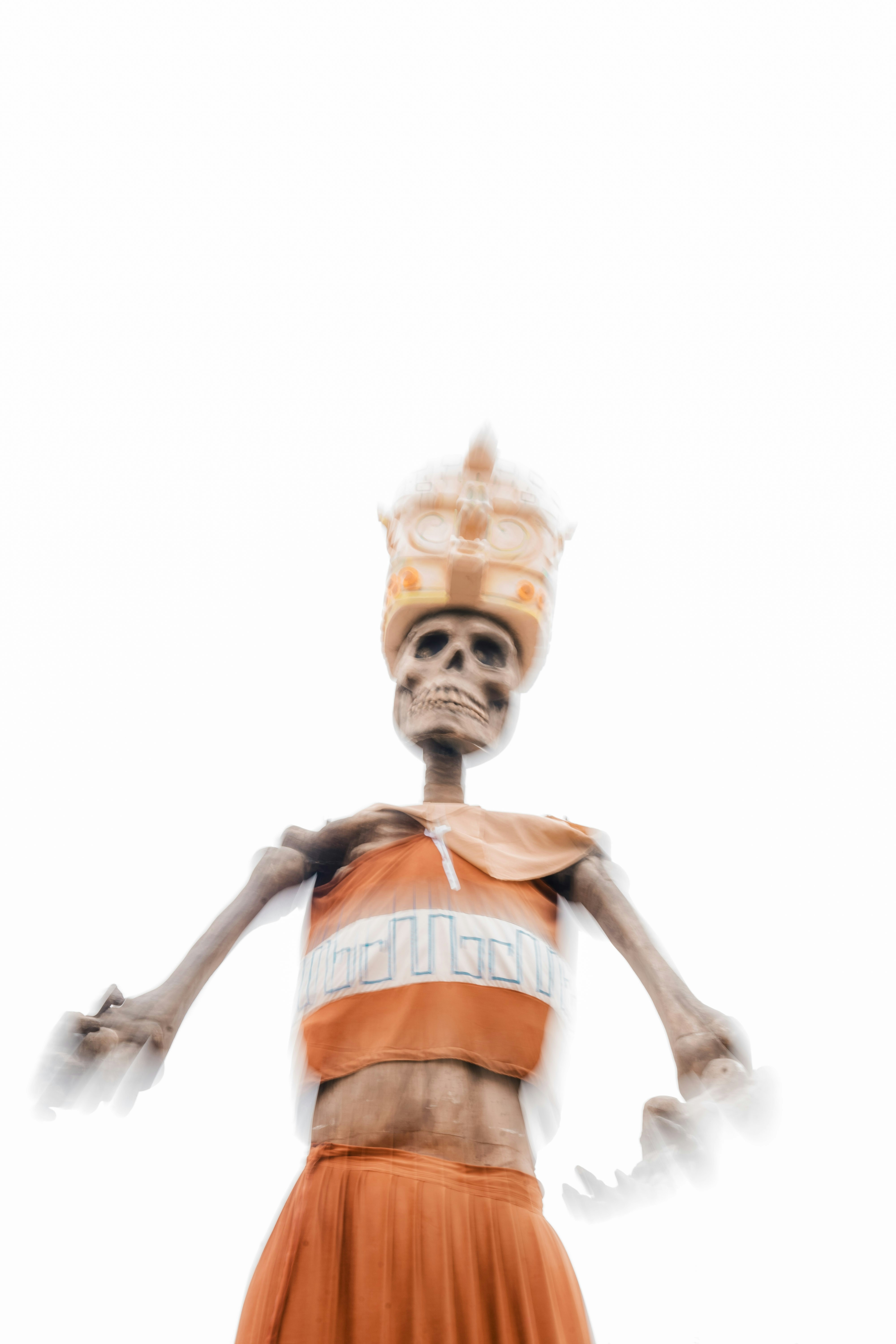 Regal Skeleton: A skeletal figure in royal regalia gazes outward