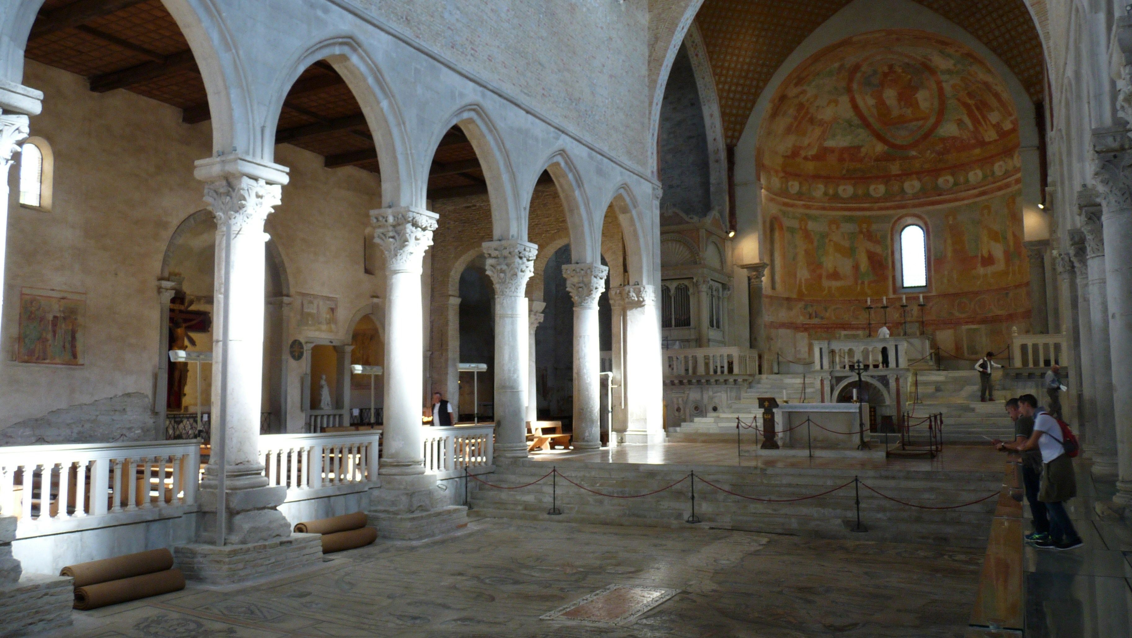 Echoes of Stone: Shadows and Arches in a Sunlit Nave