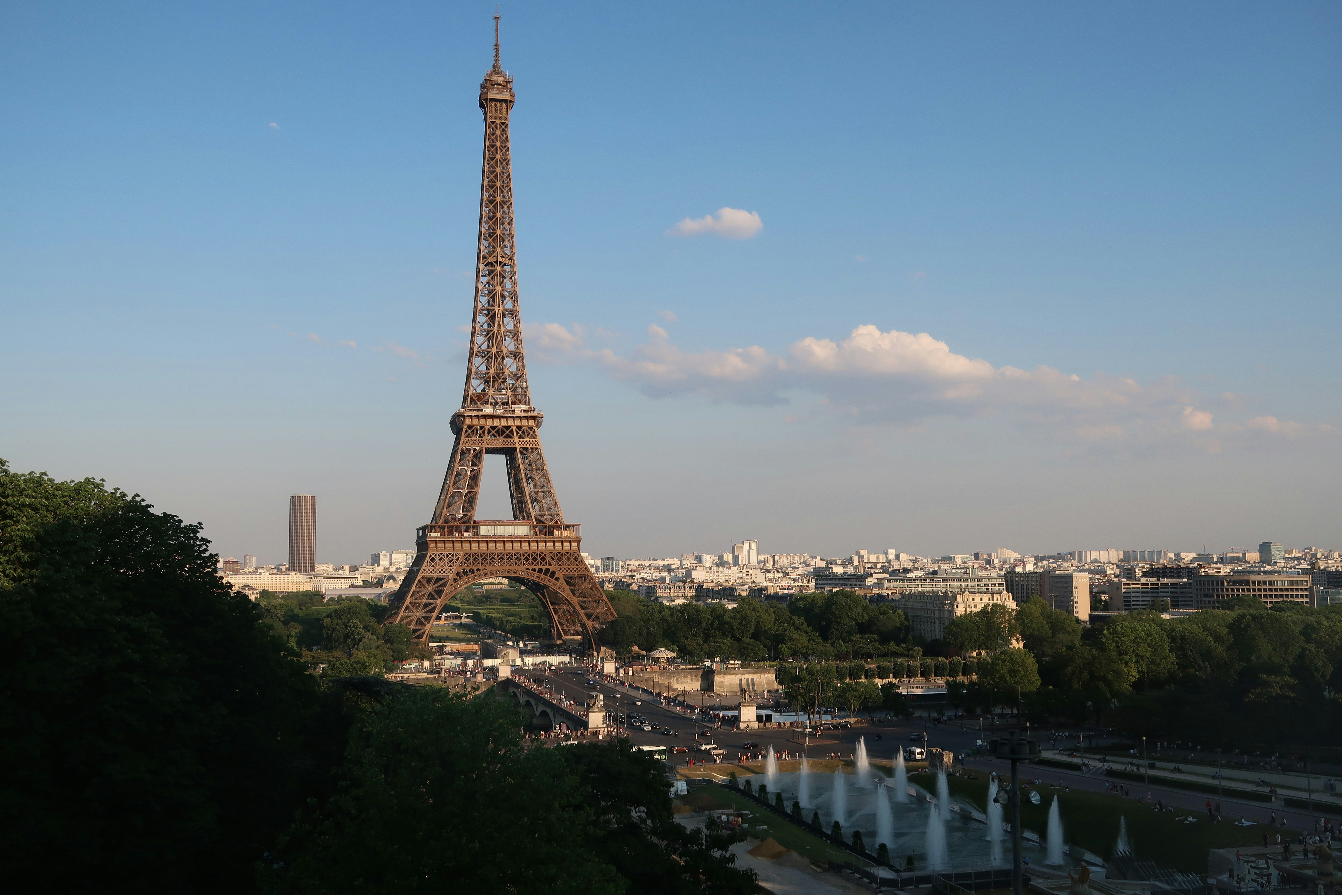 Eiffel Tower Under Clear Sky: Parisian Core and Garden Fountains