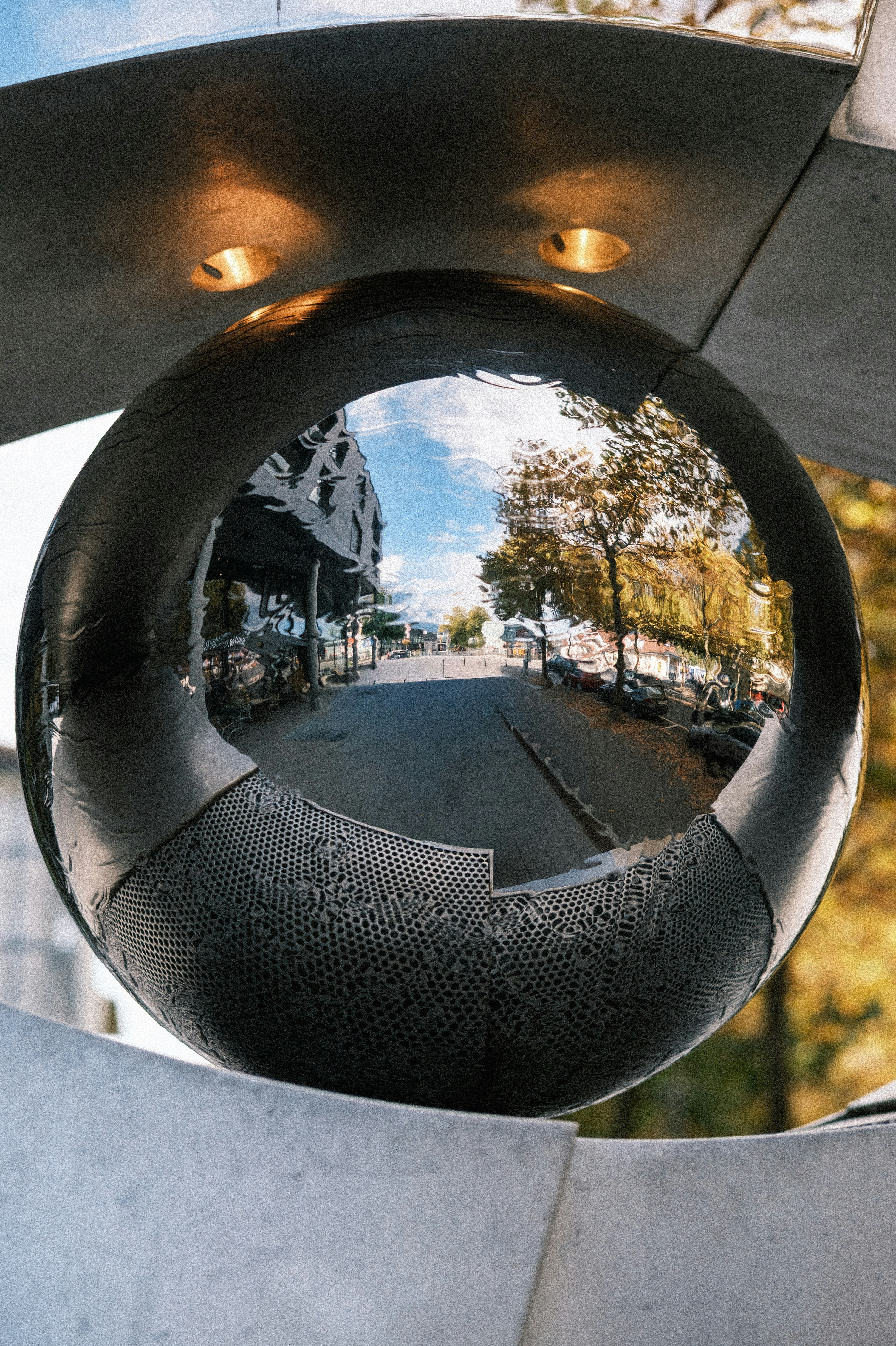 Urban Sphere: A Knob-like Reflection Framing a Street Scene