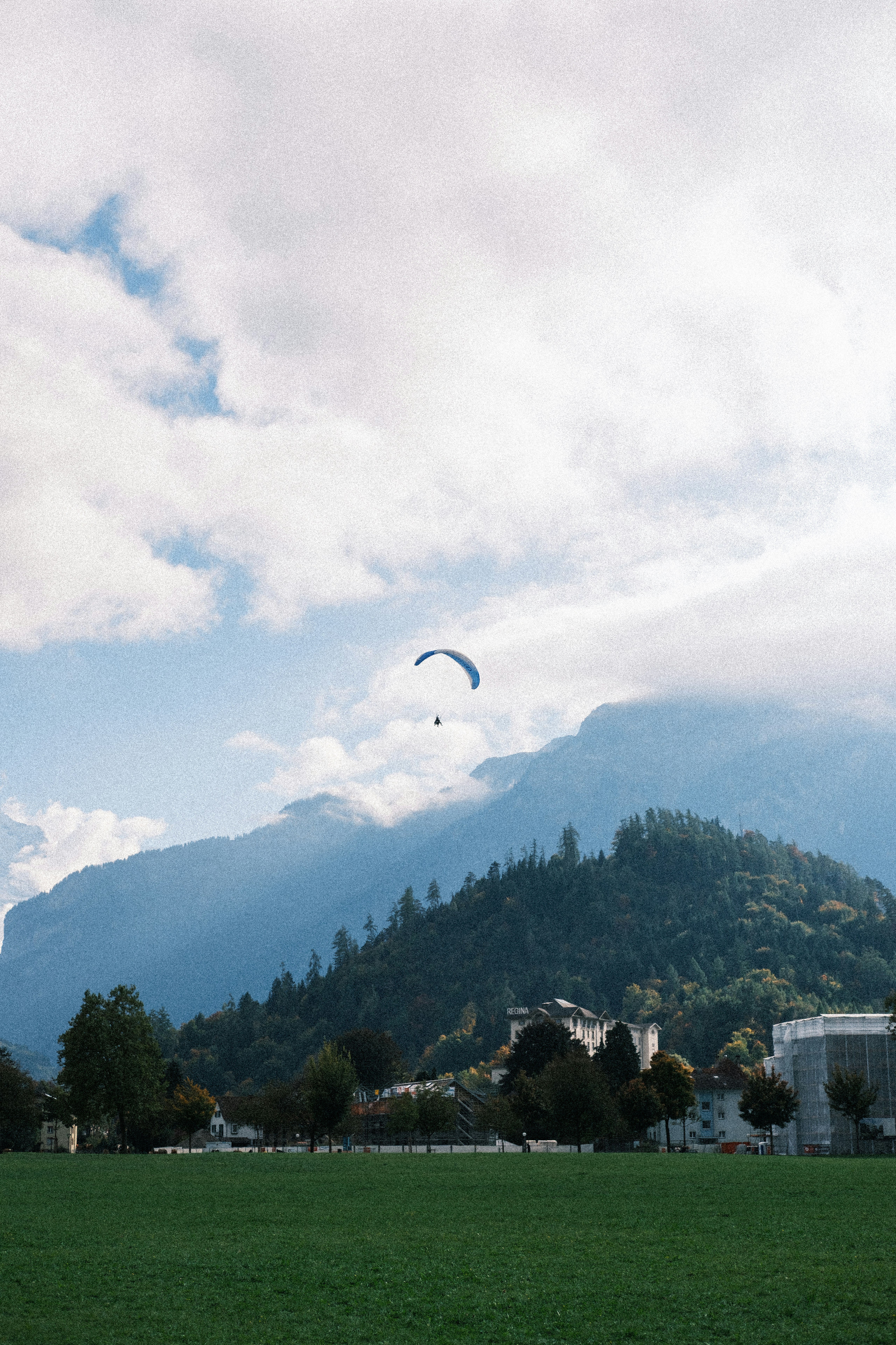 Paragliding Silhouette Over Mountain Crest