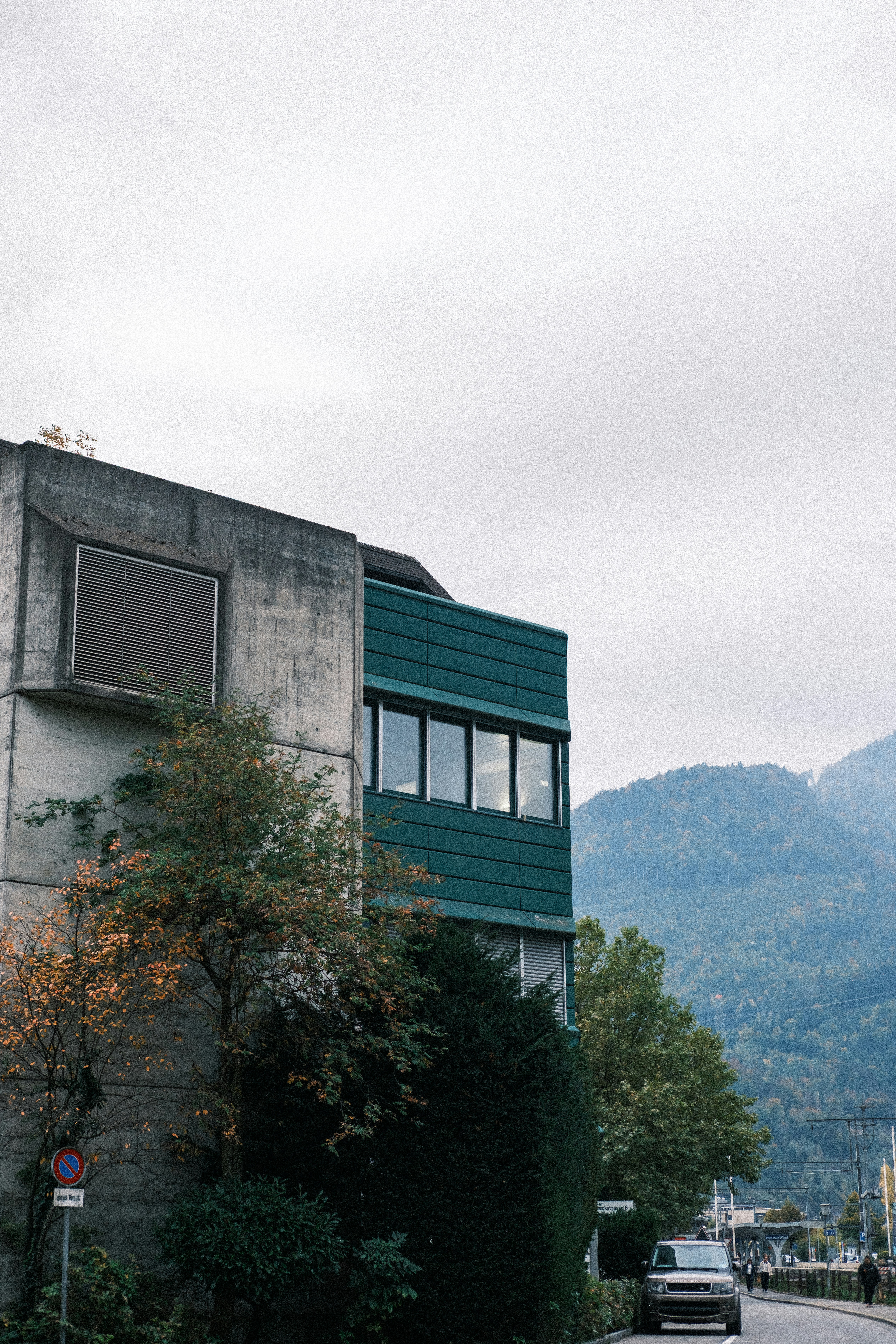 Concrete Modernity Framed by Verdant Hills