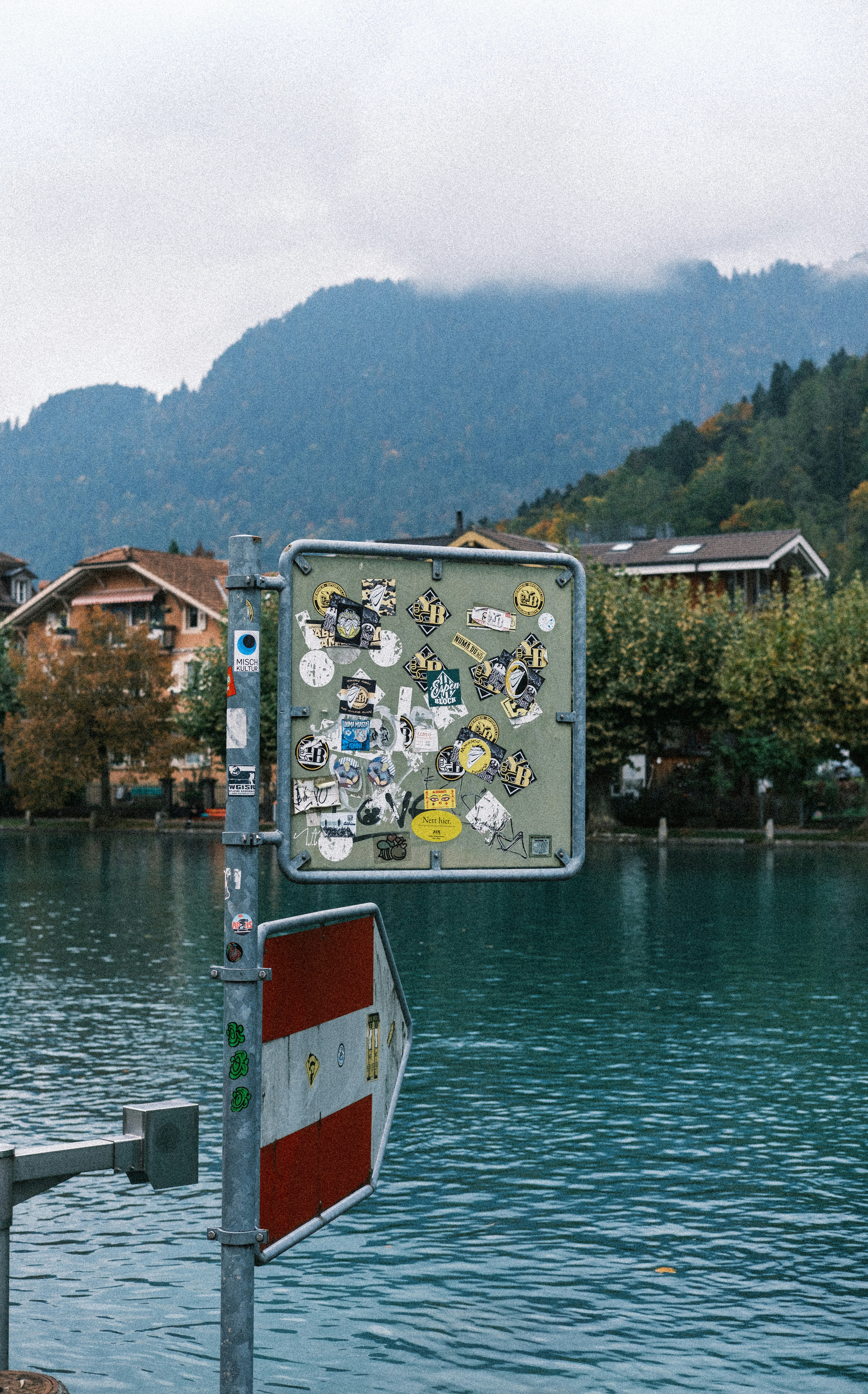 Stickered Gate by the Lake: Quiet Urban Edge