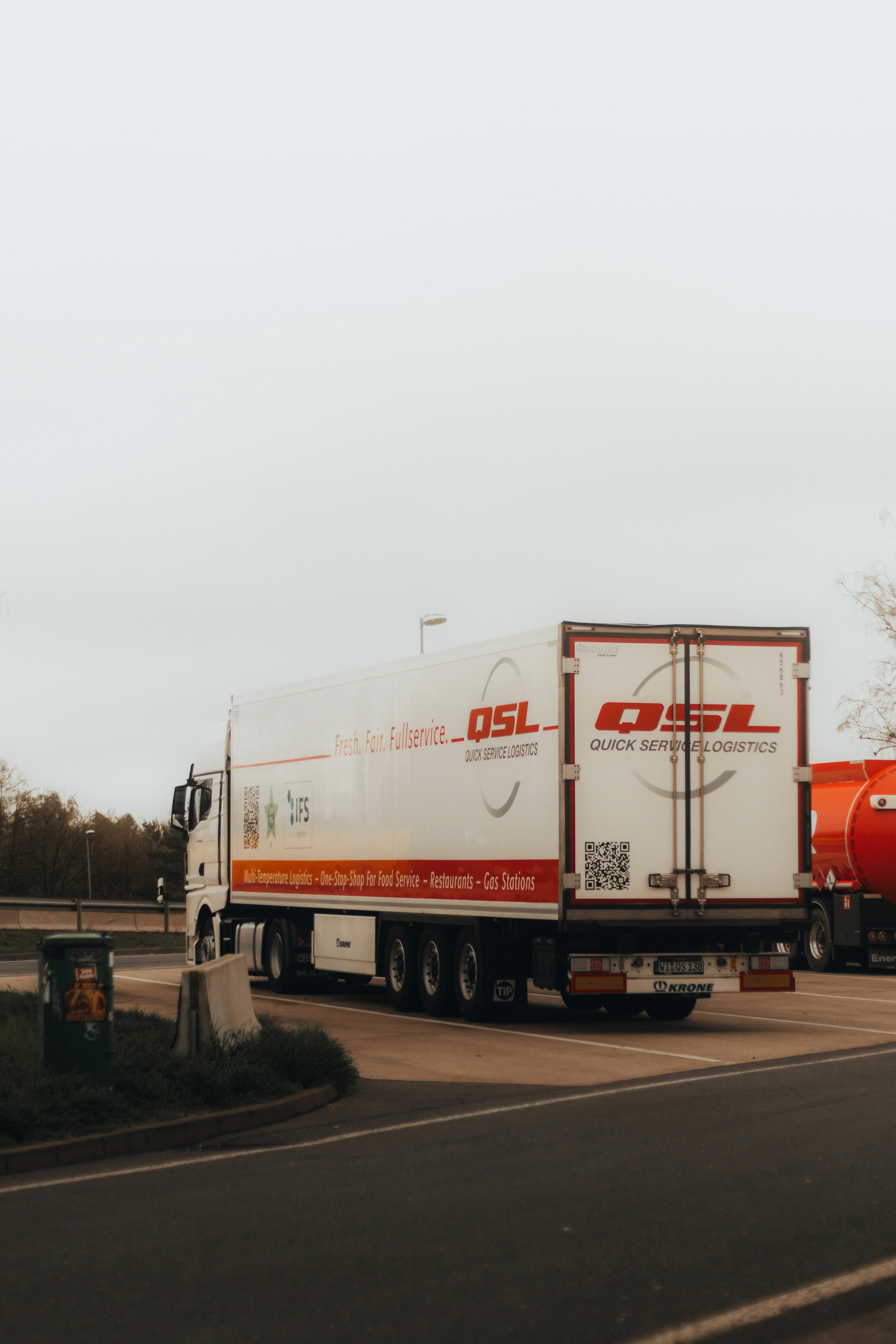 Logistics at Dusk: A Quiet Truck Resting in the Parking Lot