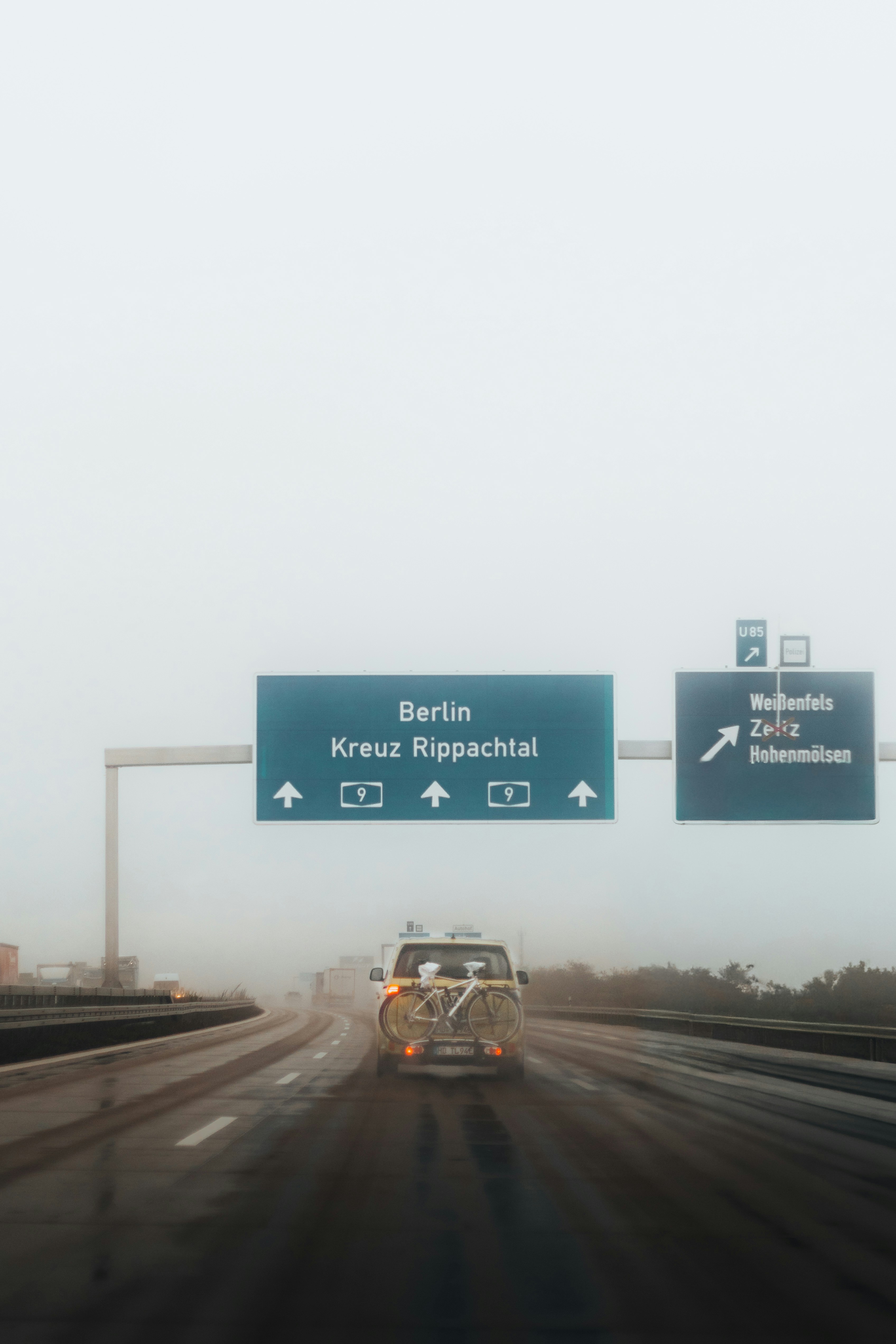 Highway Ribbons: A Bicycle Carrier Heads Home Under Gray Skies