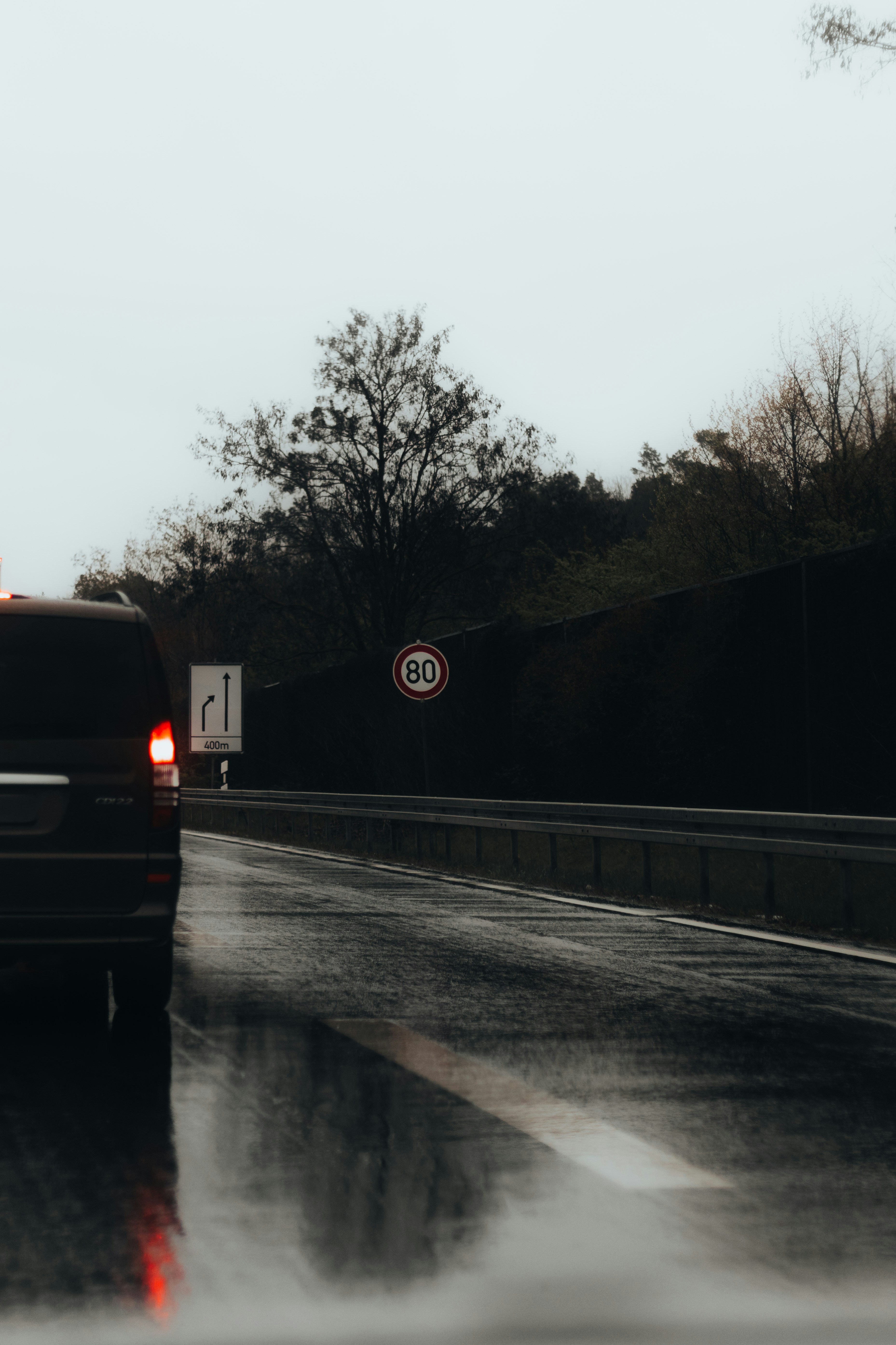 Tail Lights on a Rainy Urban Highway