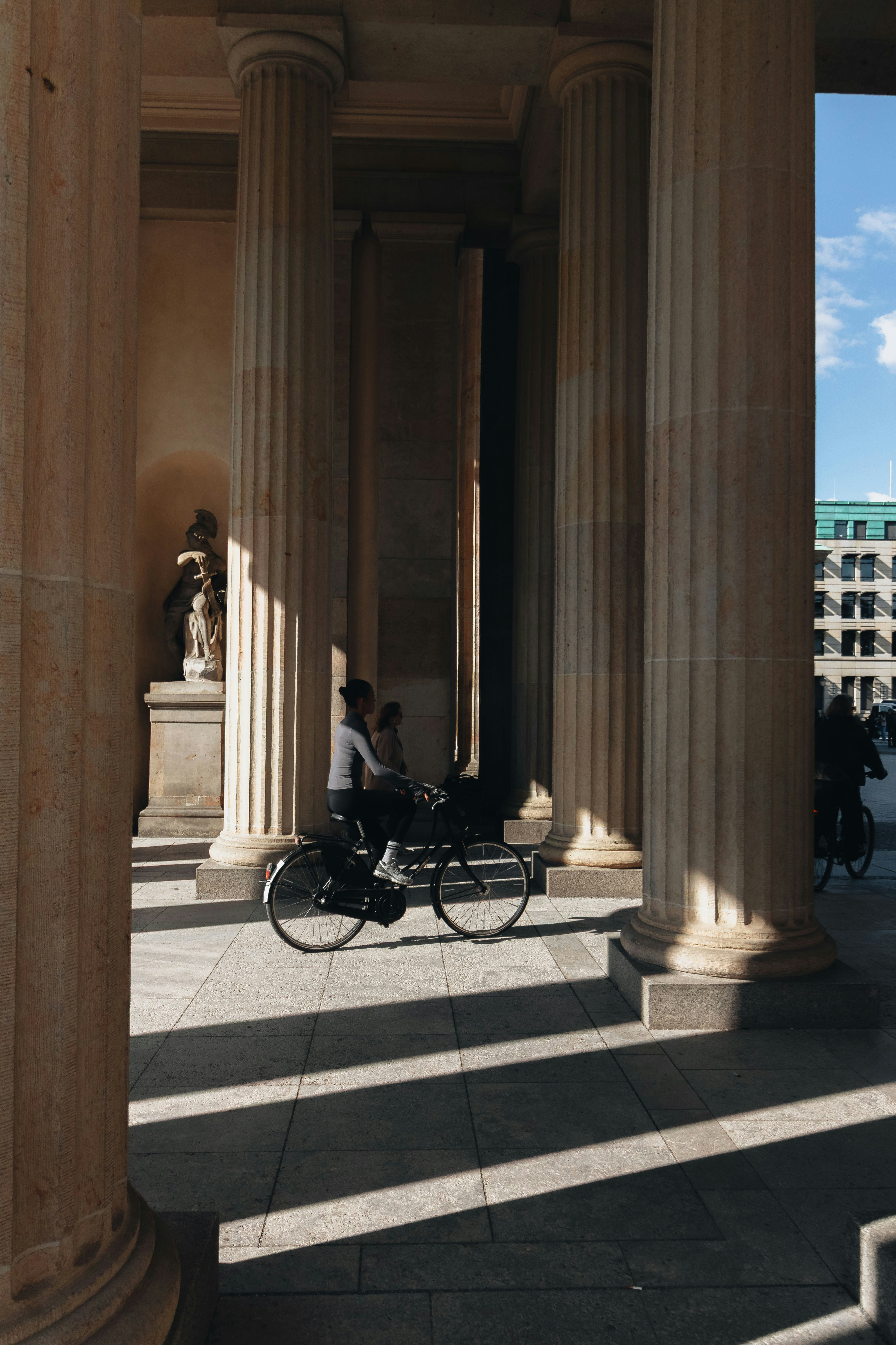 Lines of Light: Cyclists Between Colonnades