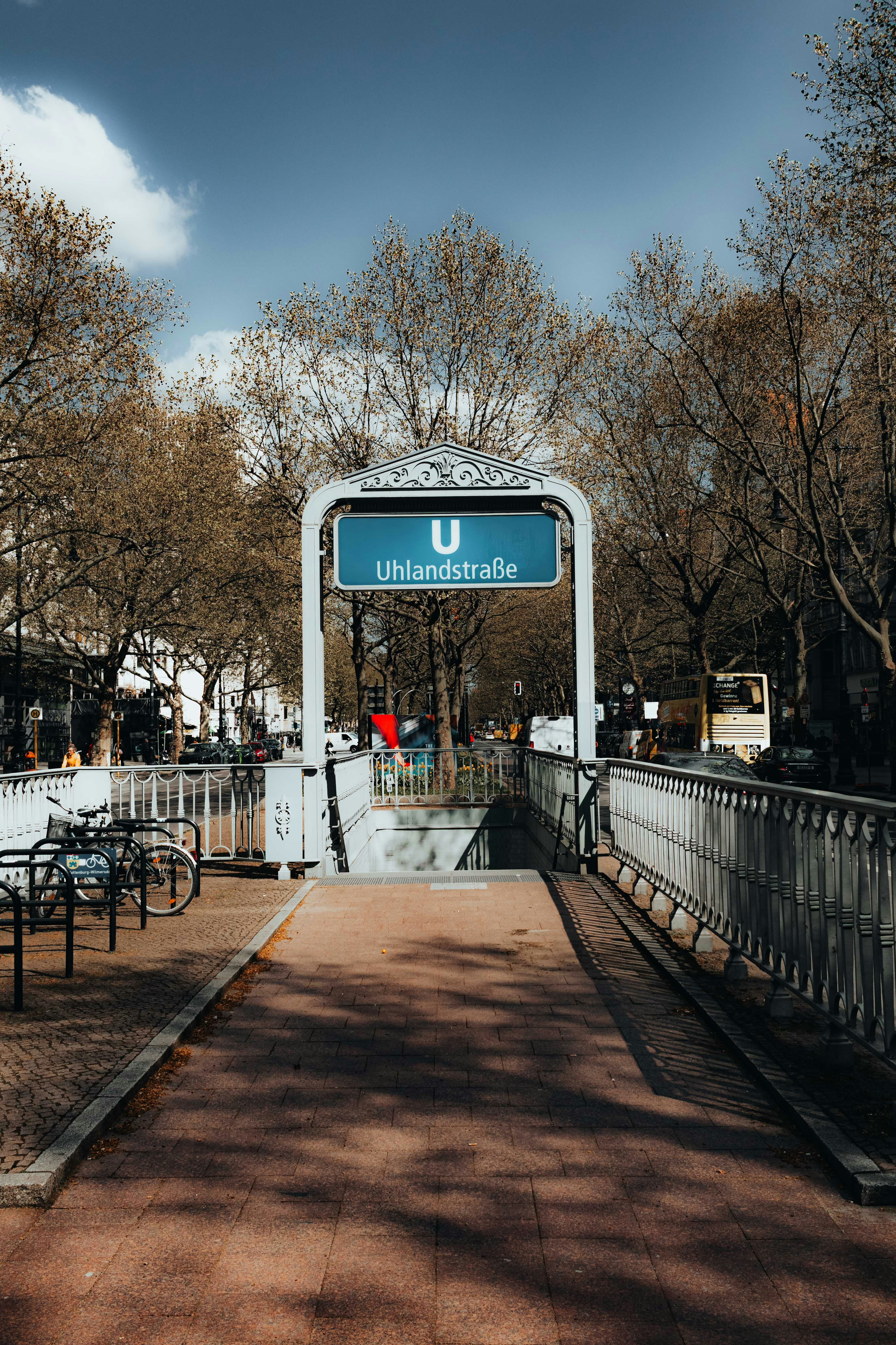 Underground City Gate: U-Bahn Entrance Framed by Autumn Armatures
