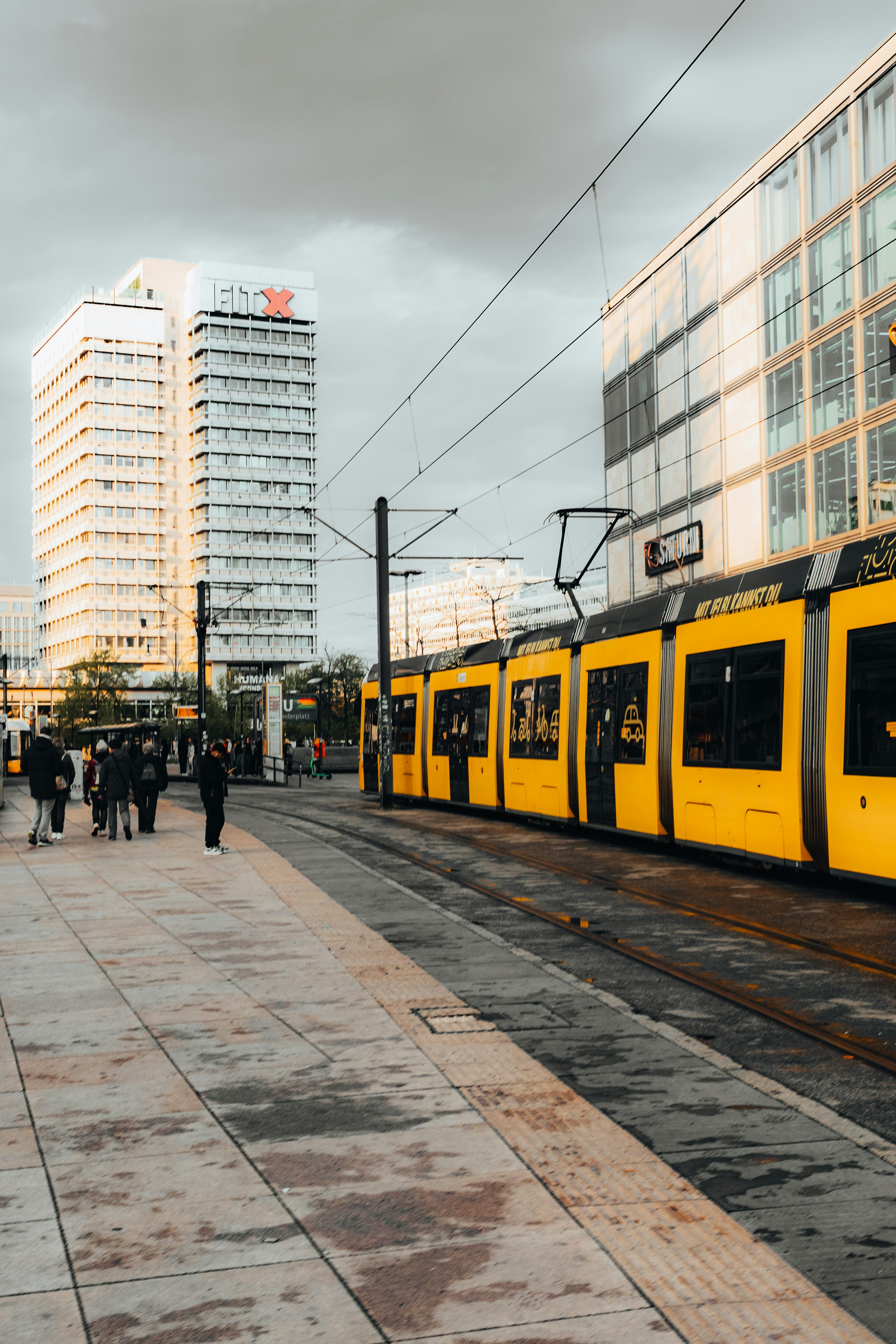 Yellow Tram at a Modern City Platform