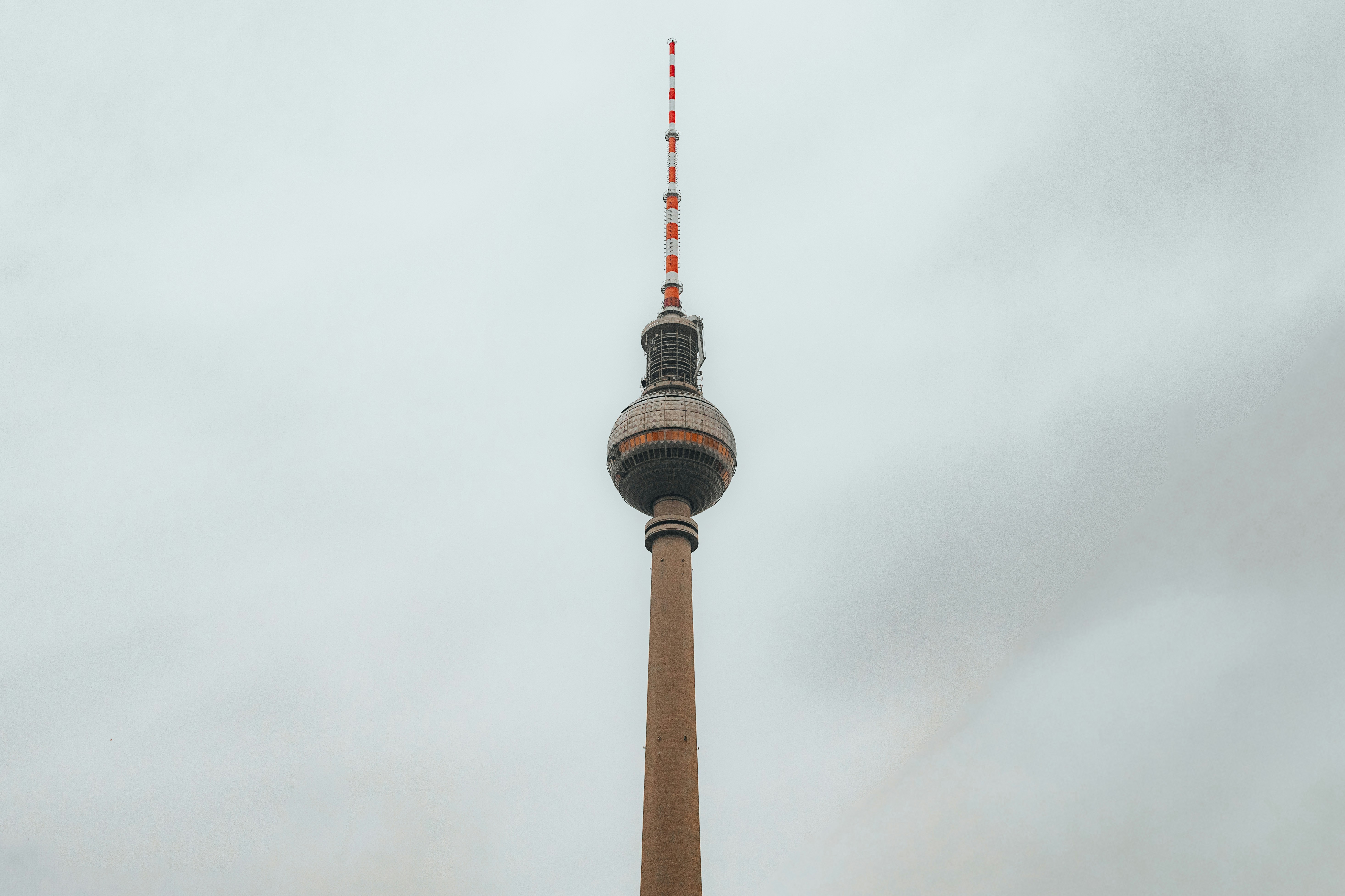Antenna Tower Piercing a Pale Sky