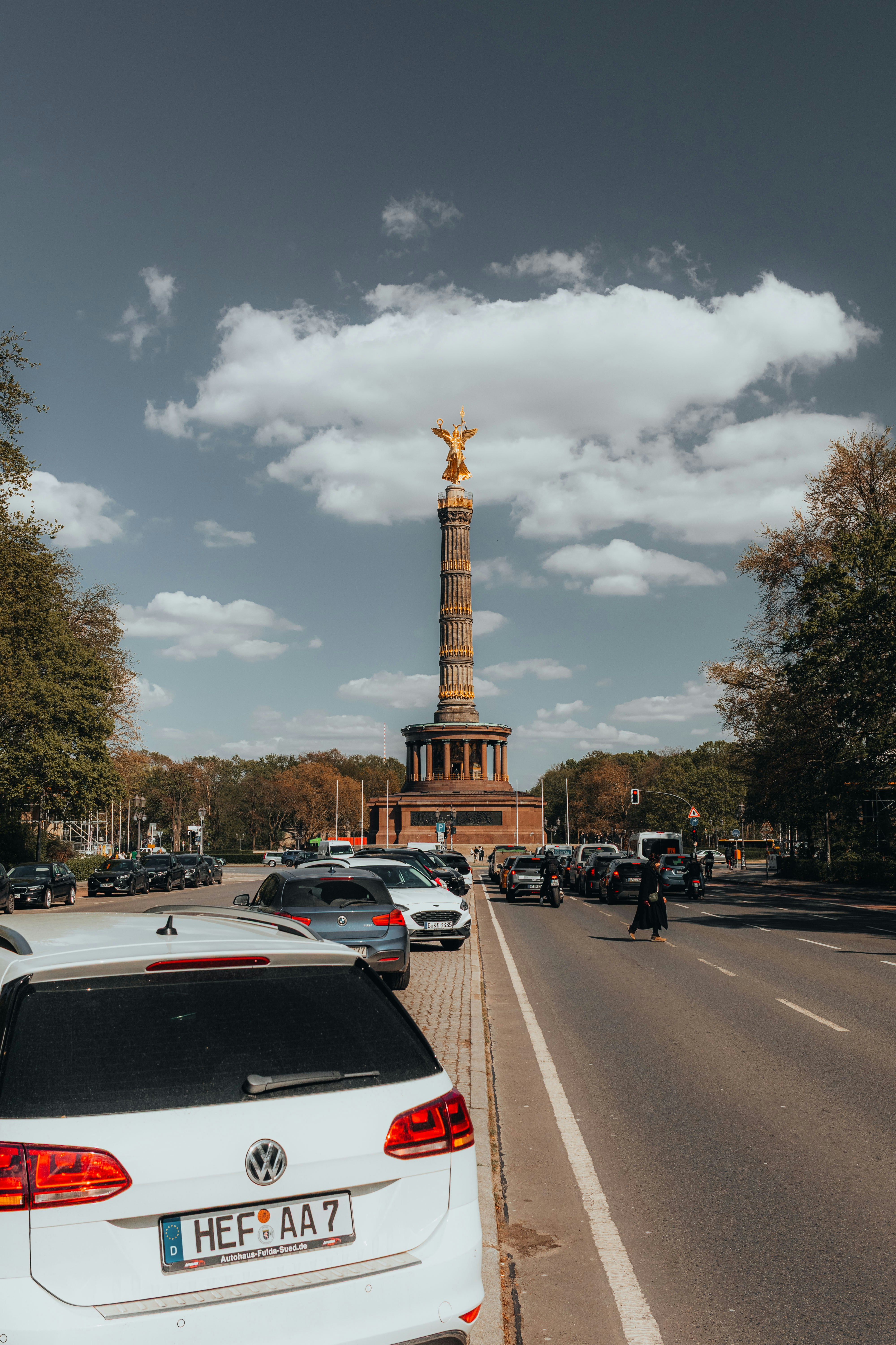 The Victory Column Framed by a Lively Boulevard