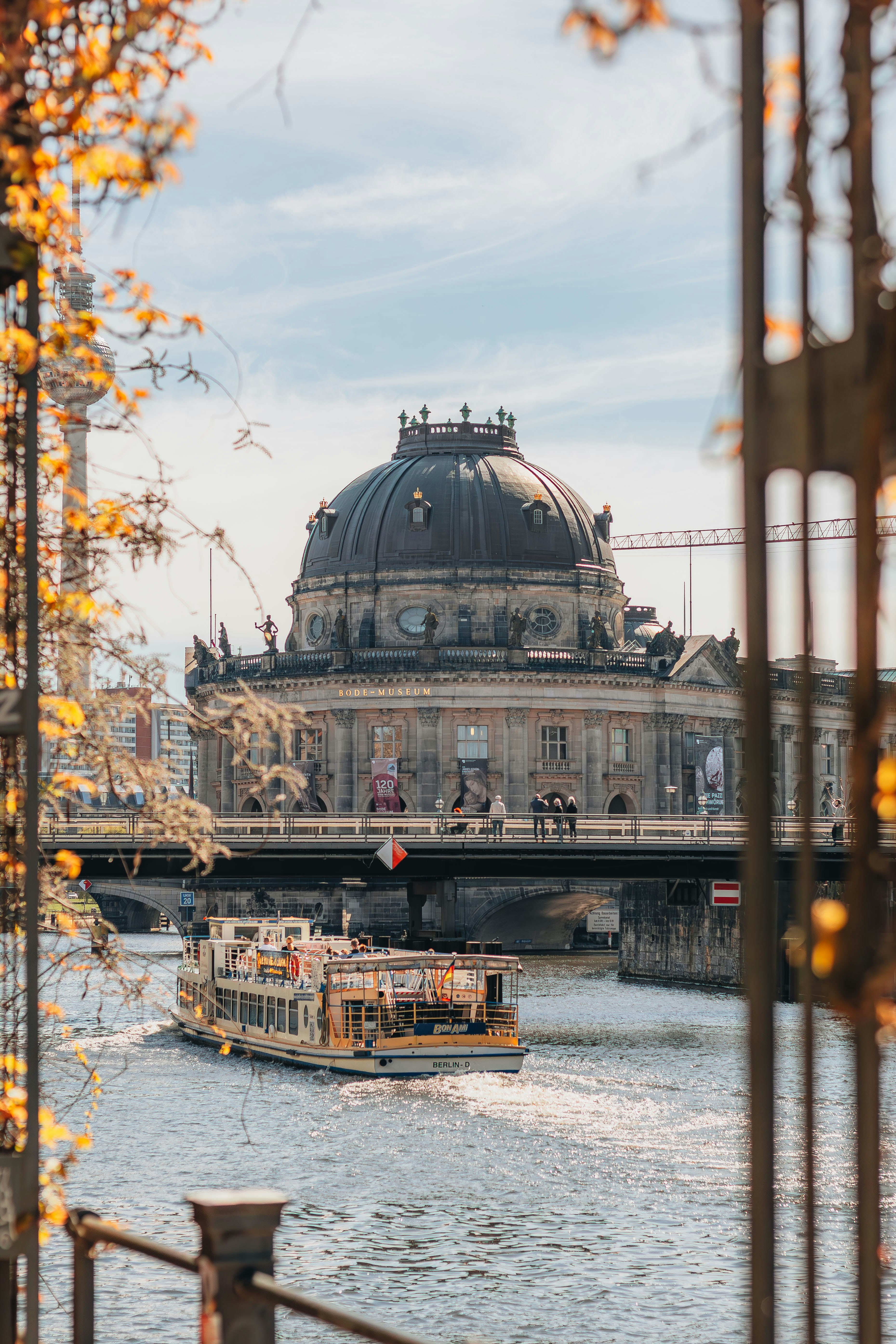 Dome over the Spree: A Riverside Opera House Framed by Autumn Riﬂes