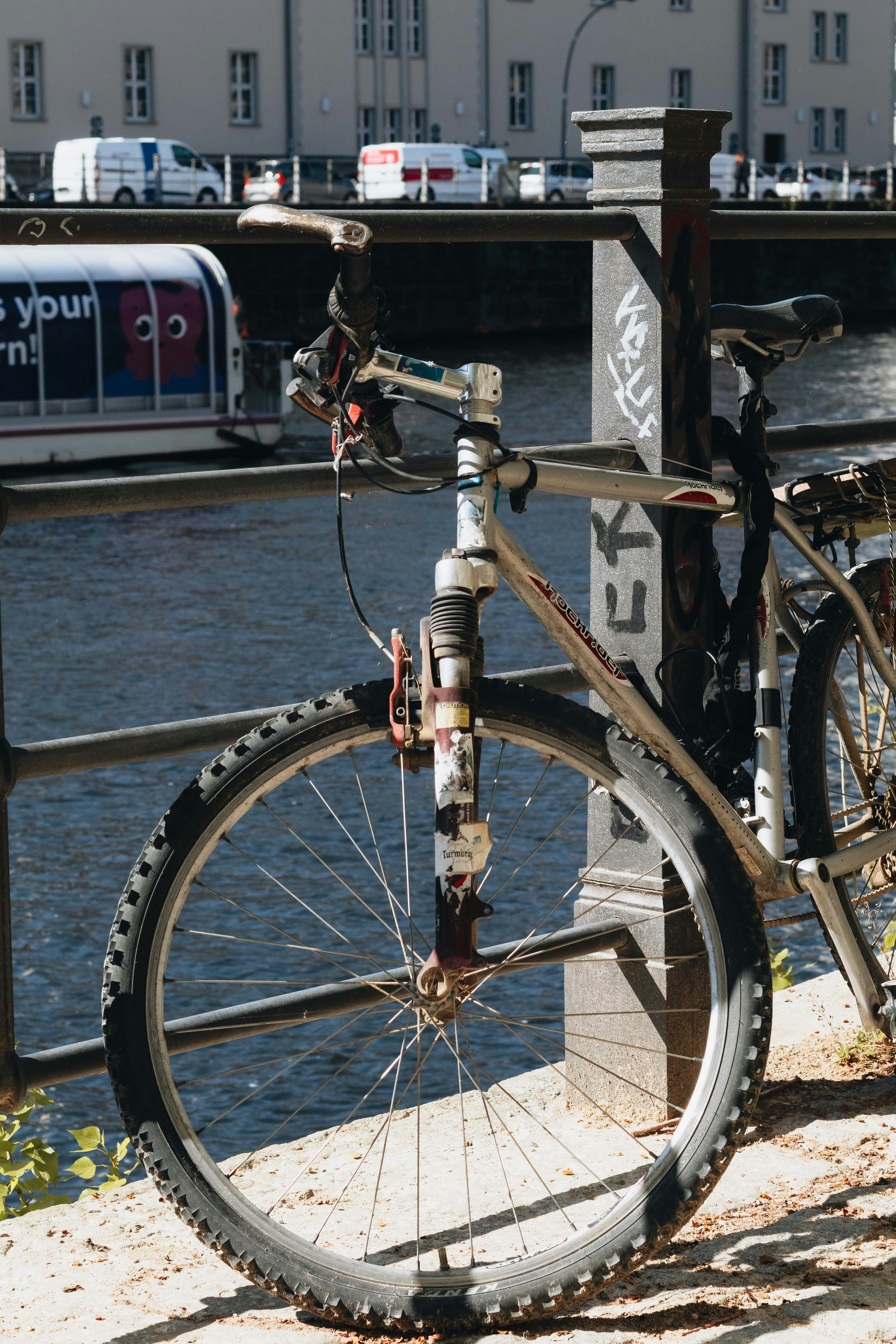 Urban Bicycle Leaning Against a Pier by the Water