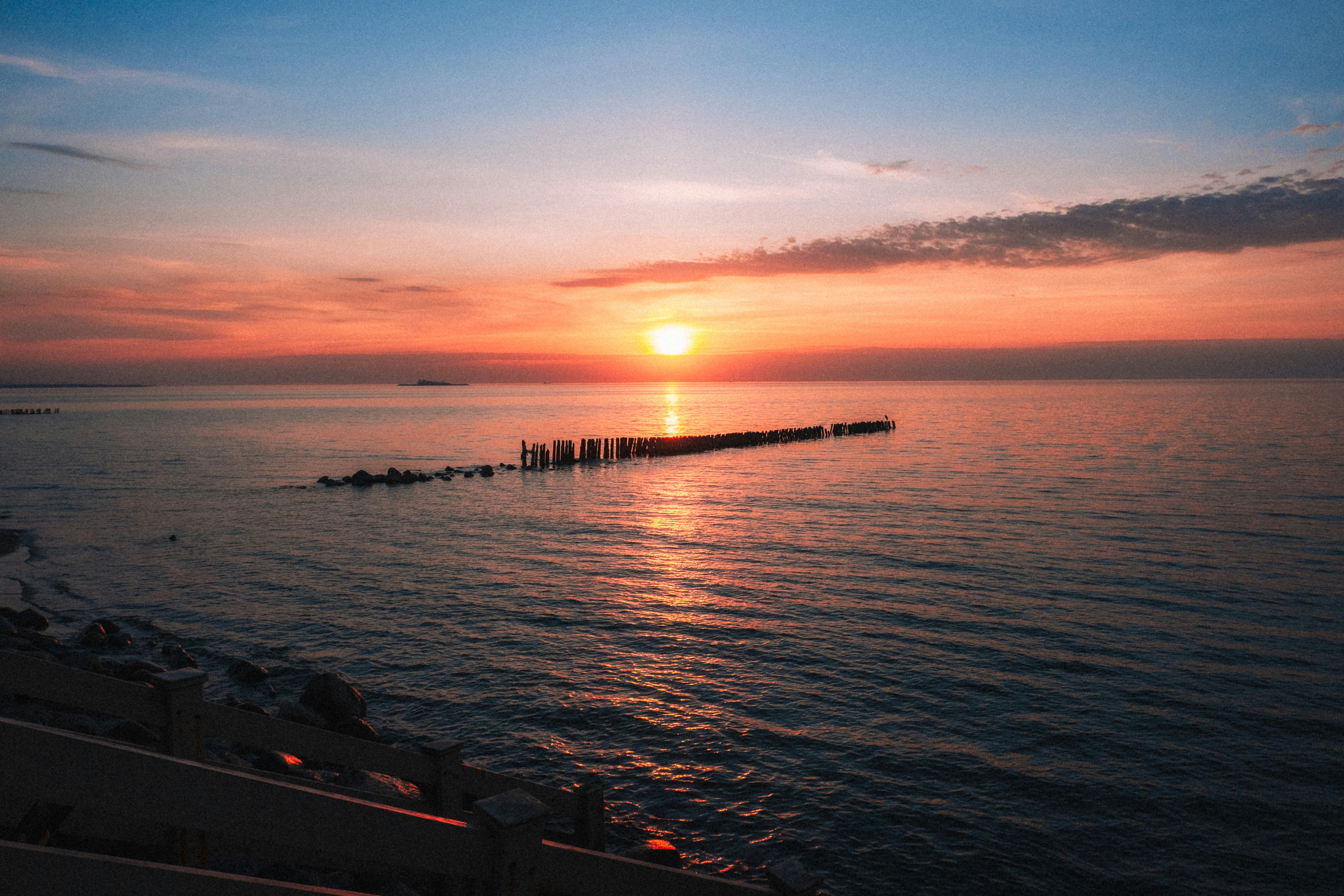 Sunset Pier: A Quiet Convergence of Light over a Distant Jetty