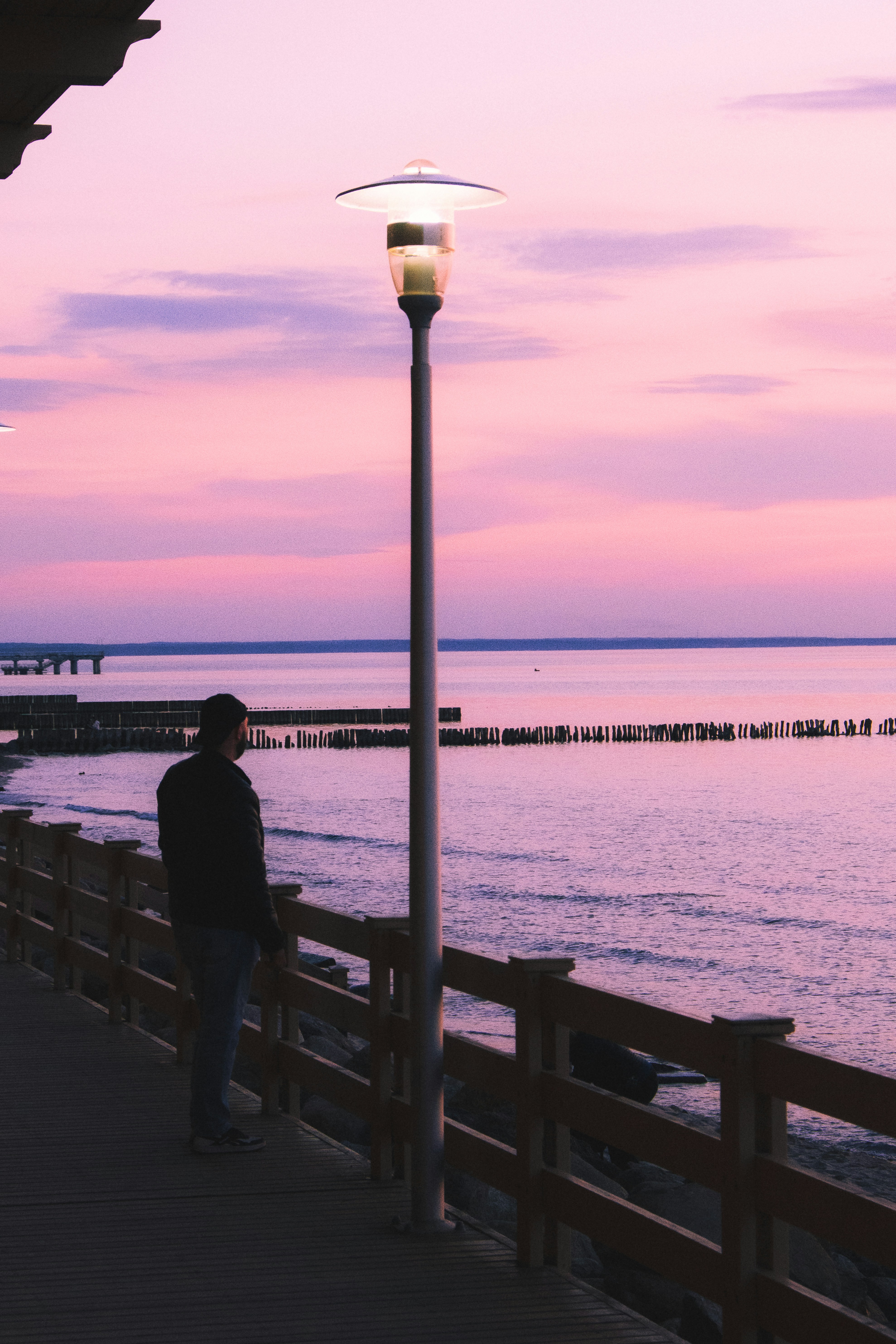 Silhouette by the Sea: A Quiet Evening on the Pier