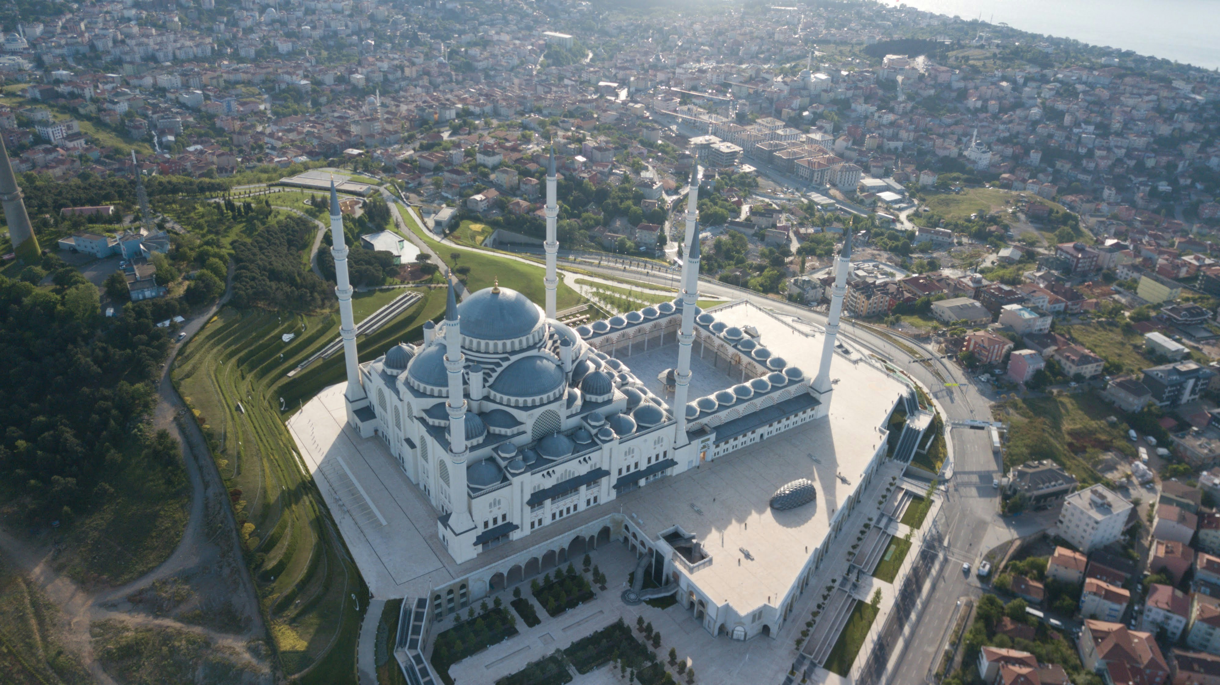 White Dome and Minarets Rising Above a Crescent-Outlined Complex