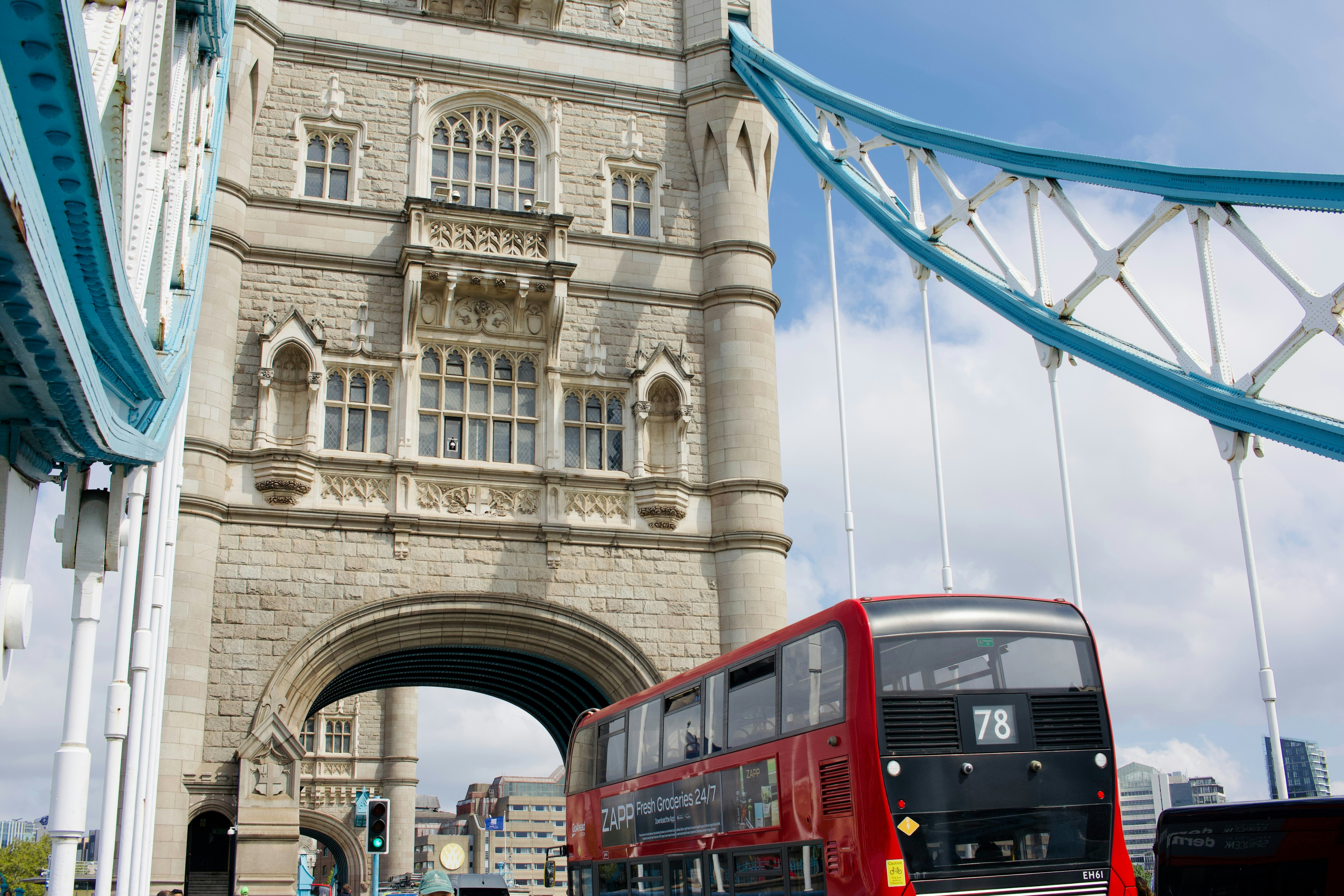 Tower Bridge Commuter Arc: Red Double-Decker Under the Rise