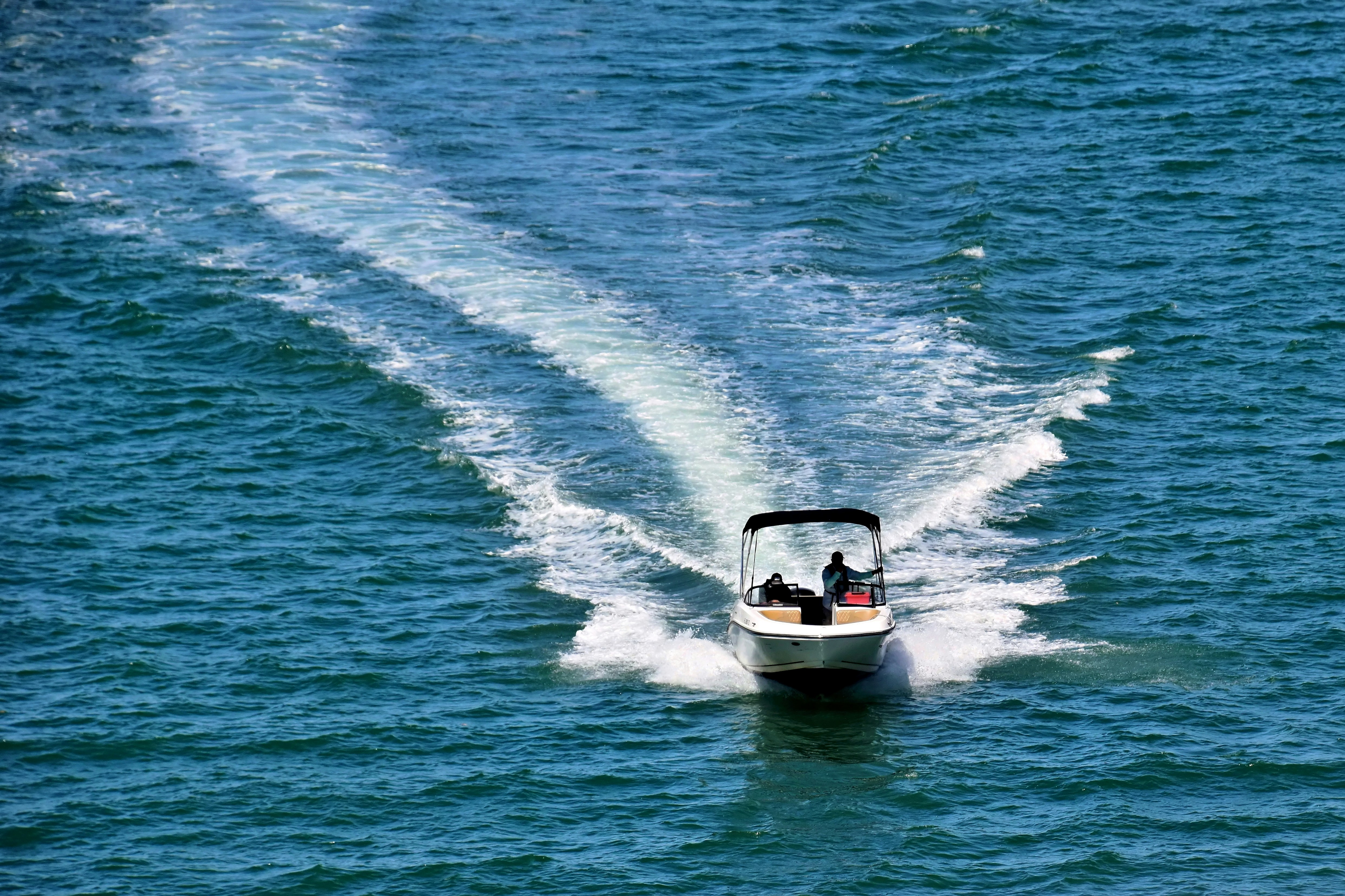 High-Speed Wake: A Small Boat Pierces the Open Sea