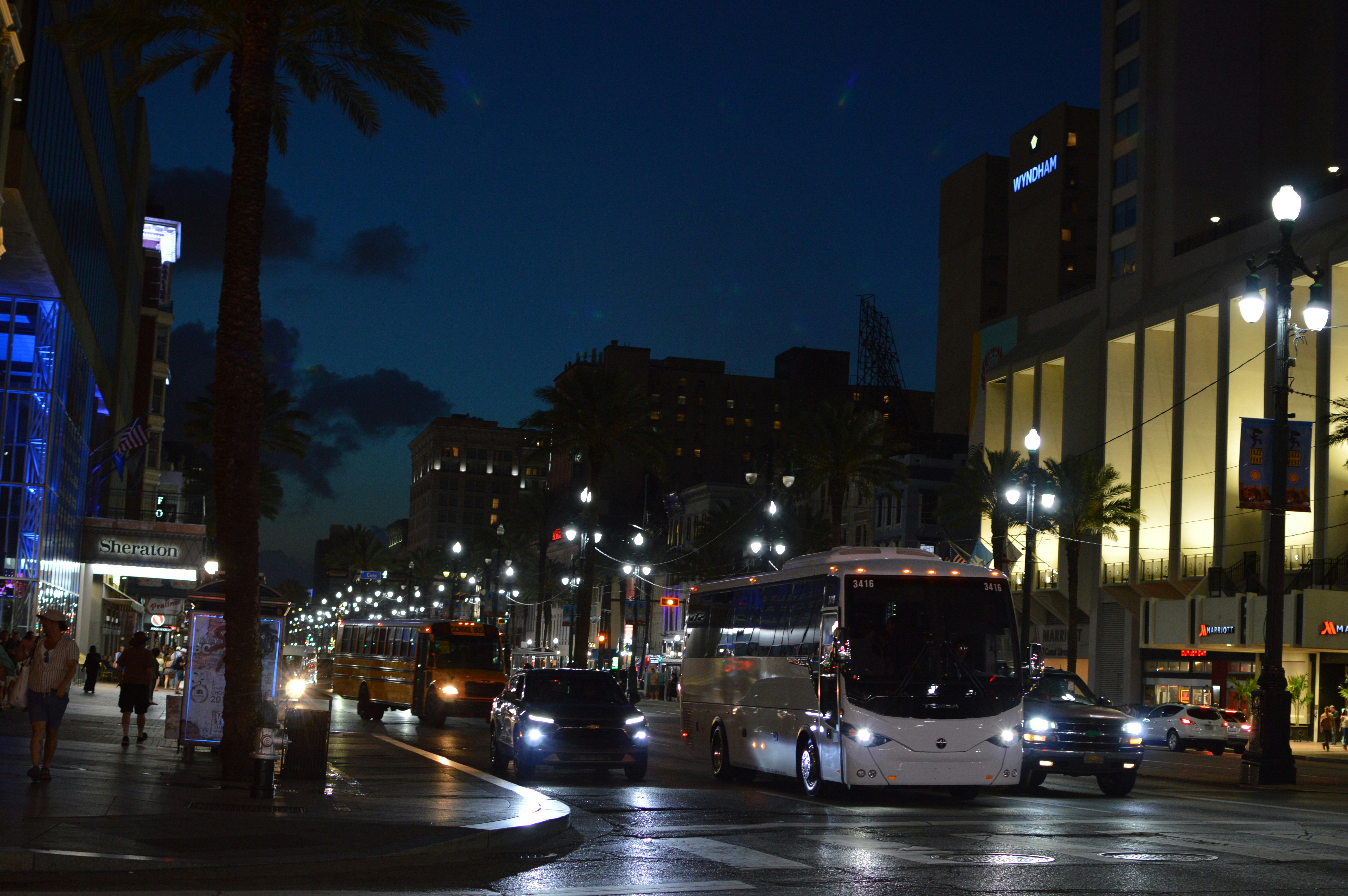 City Night Flow: Buses in Neon Street
