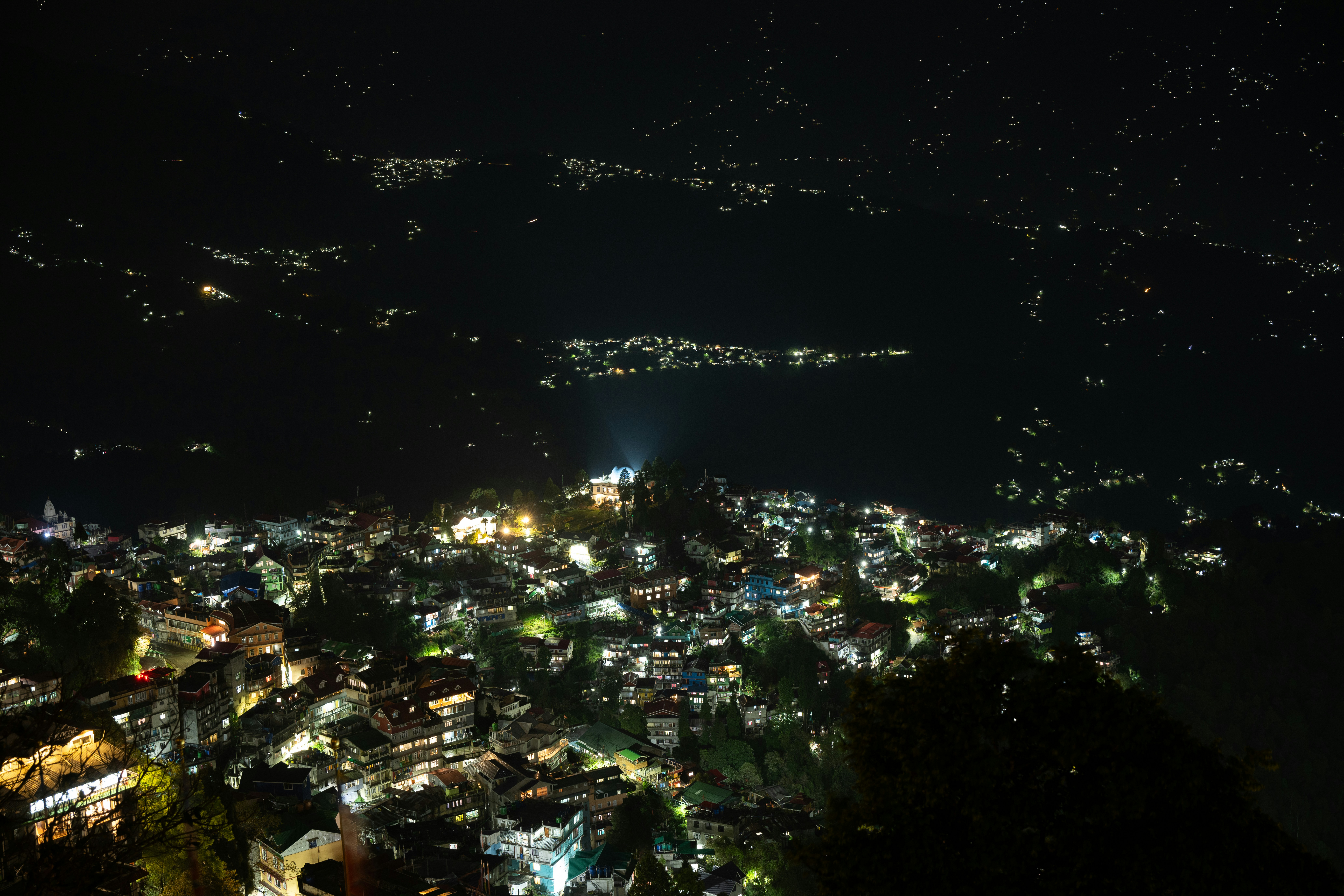 Nightward: A Terraced Town Lanterns in a Valley