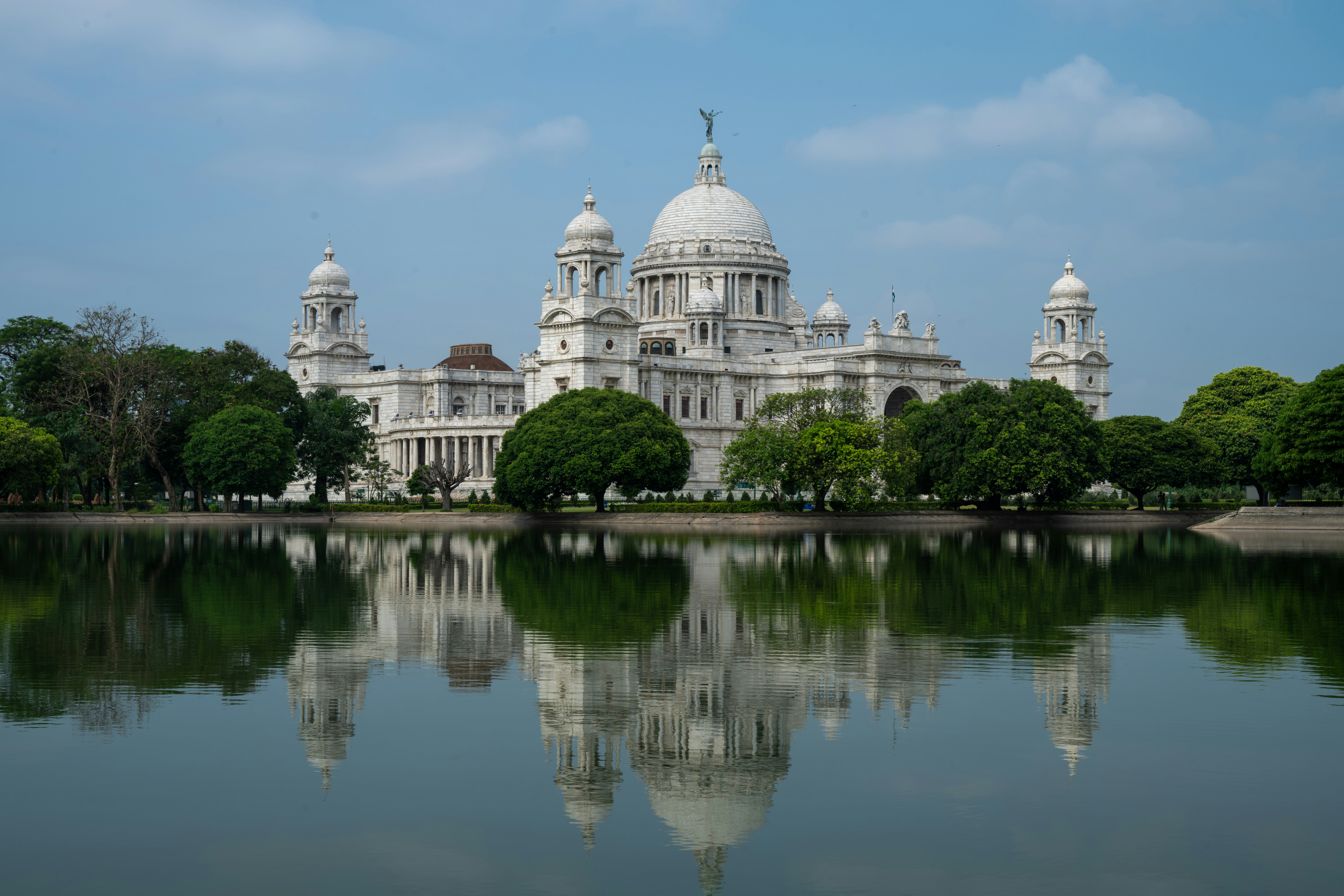 Reflections of a Marble Bastion: The Viceregal Dome Across a Calm Riverside