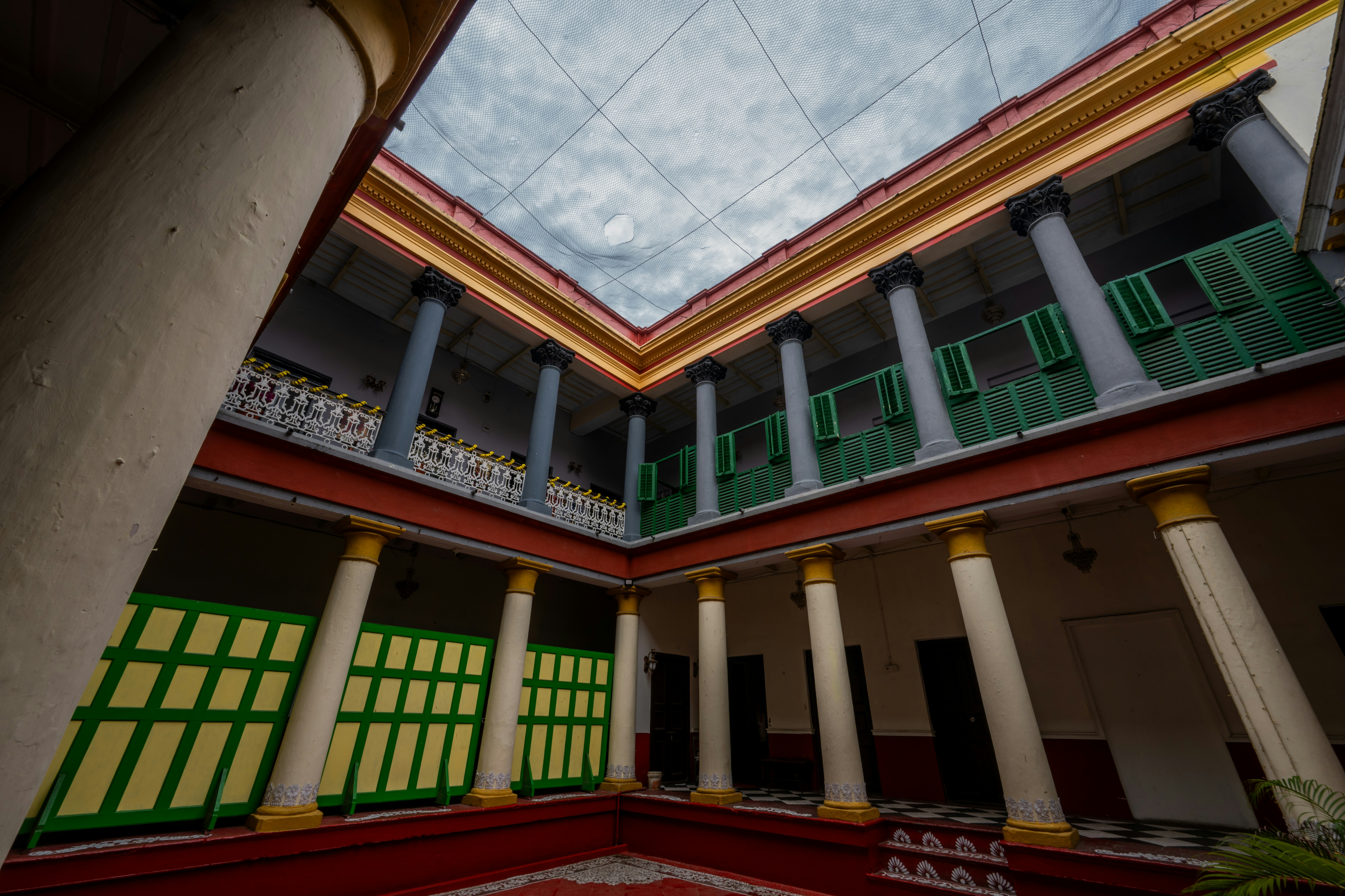 Courtyard Under Painted Skies: A Geometric Oasis