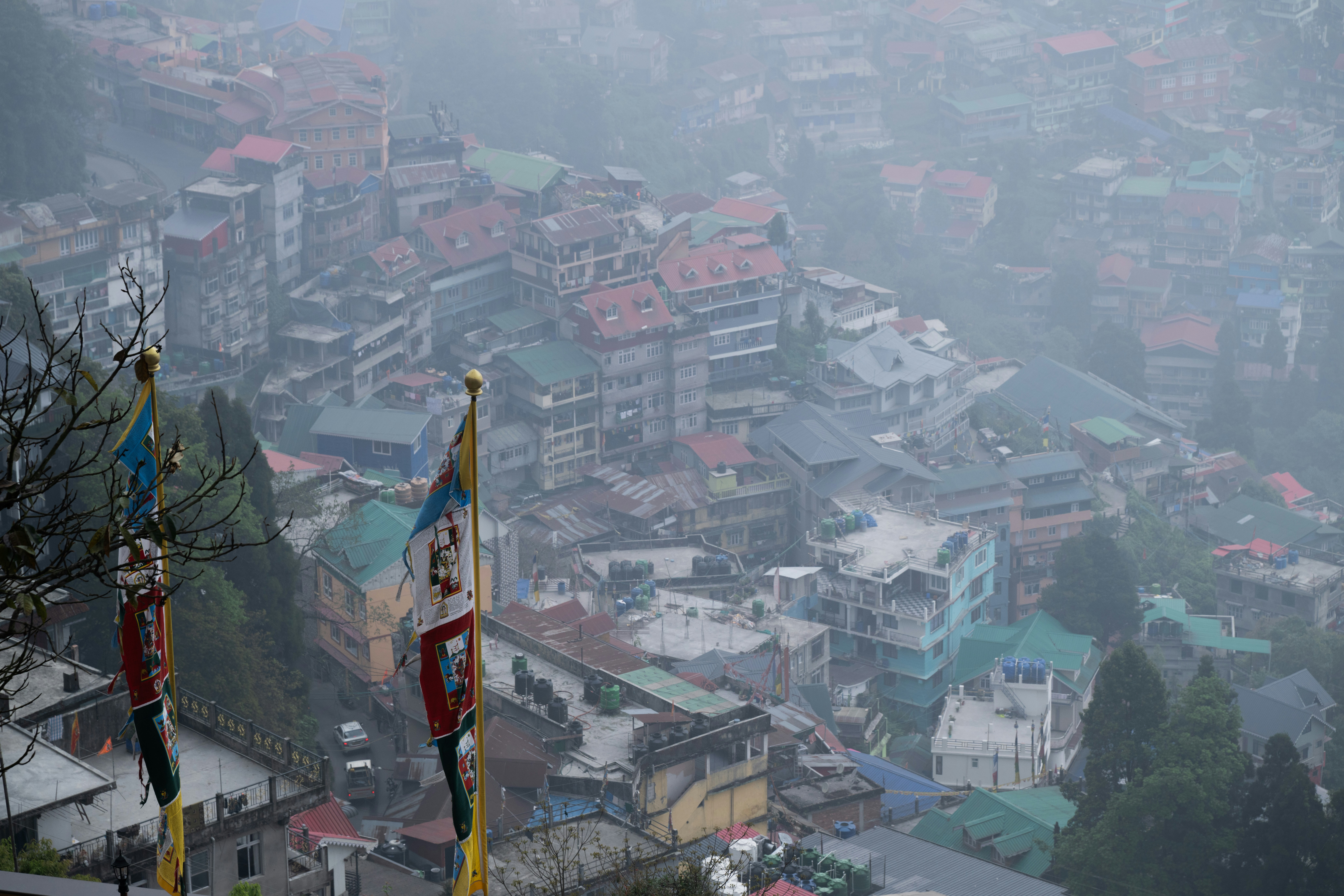 Hazy hillside village woven with colorful roofs