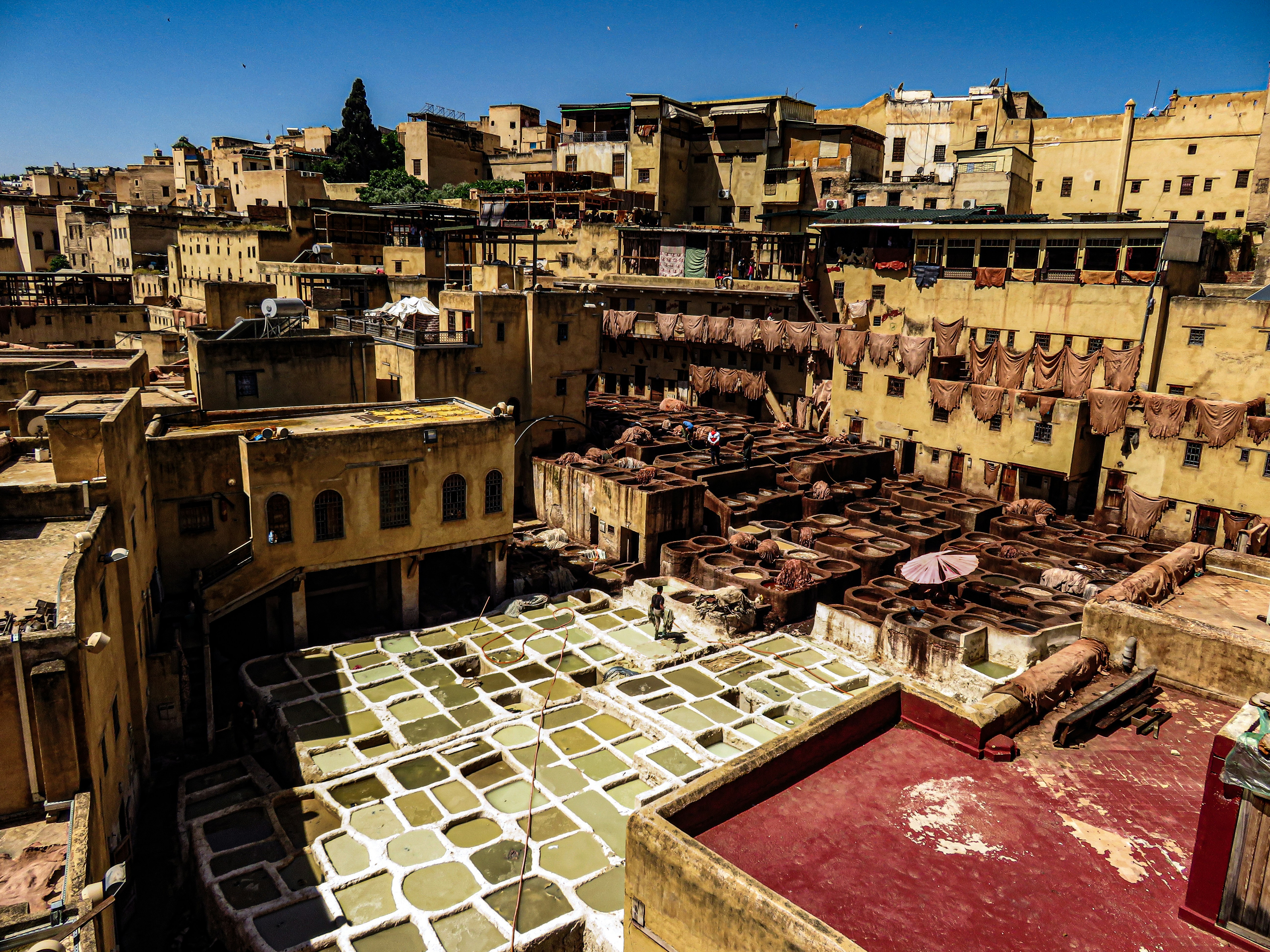 Terraced rooftops and sunlit courtyards of a Middle Eastern hill town
