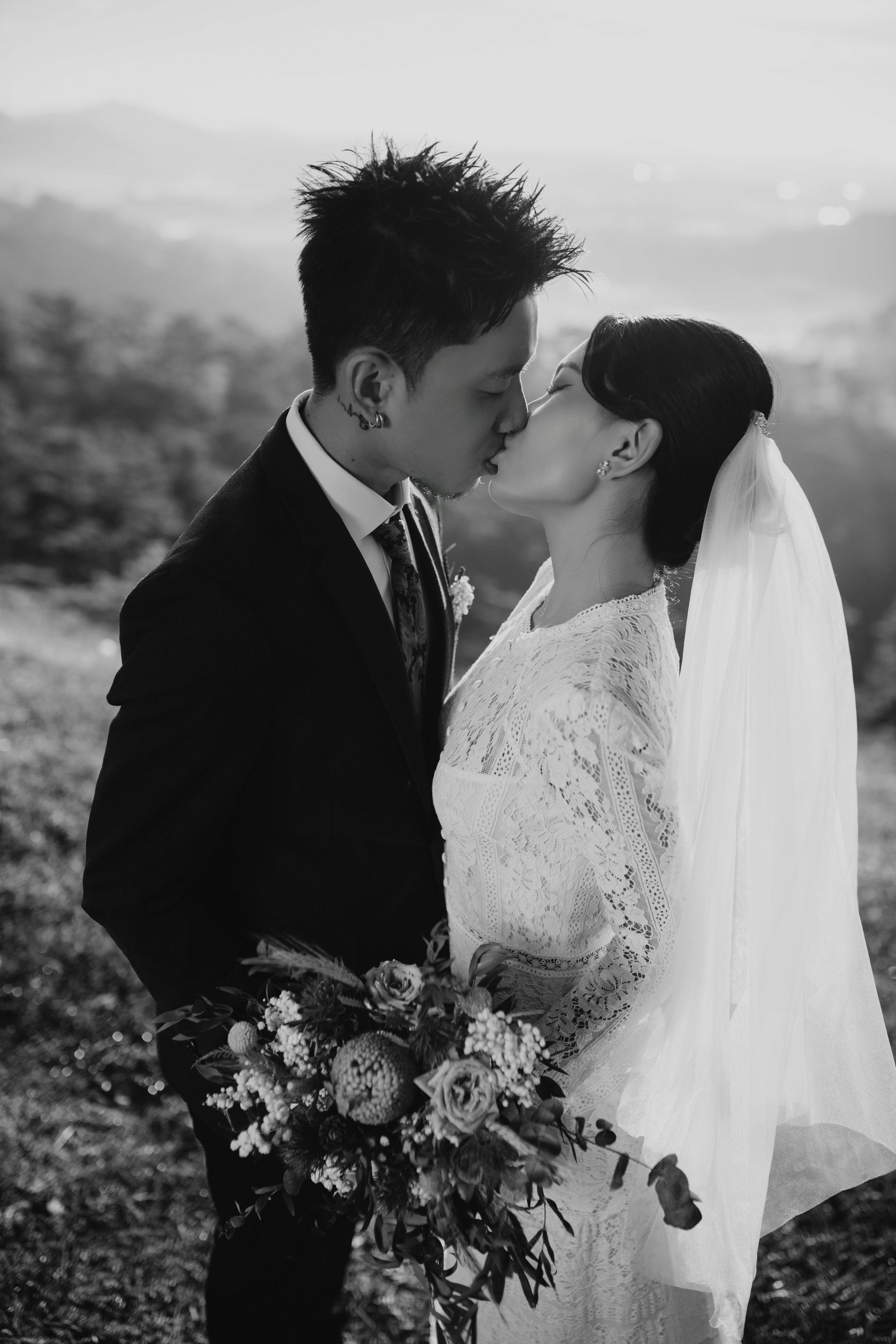 A Quiet Kiss at Golden Hour: Bride and Groom in Silhouette