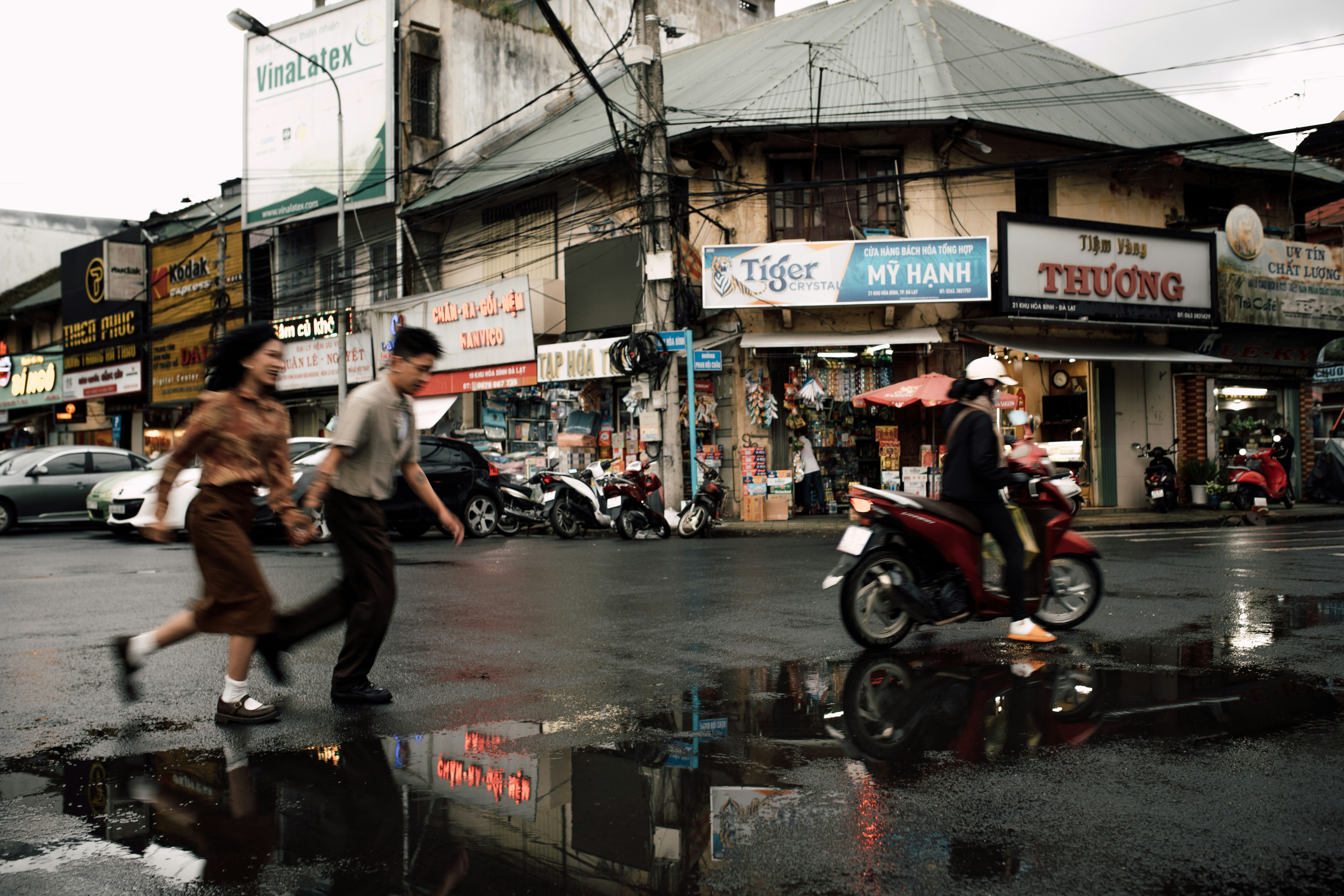 Crosswalk in Rain: Motion, Signs, and Reflections