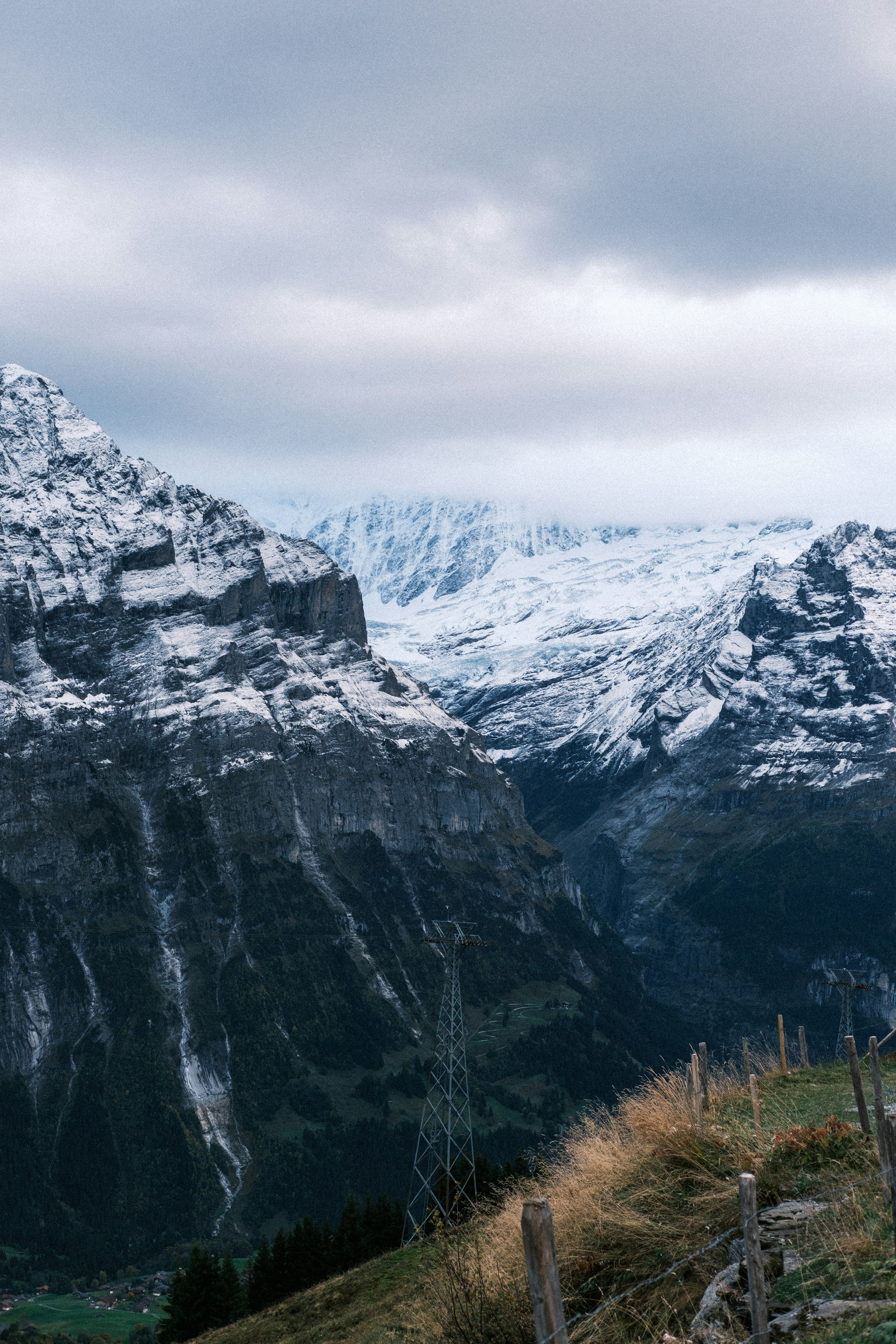 Snow-Wedged Crest: A Mountain Pass Under Gray Skies