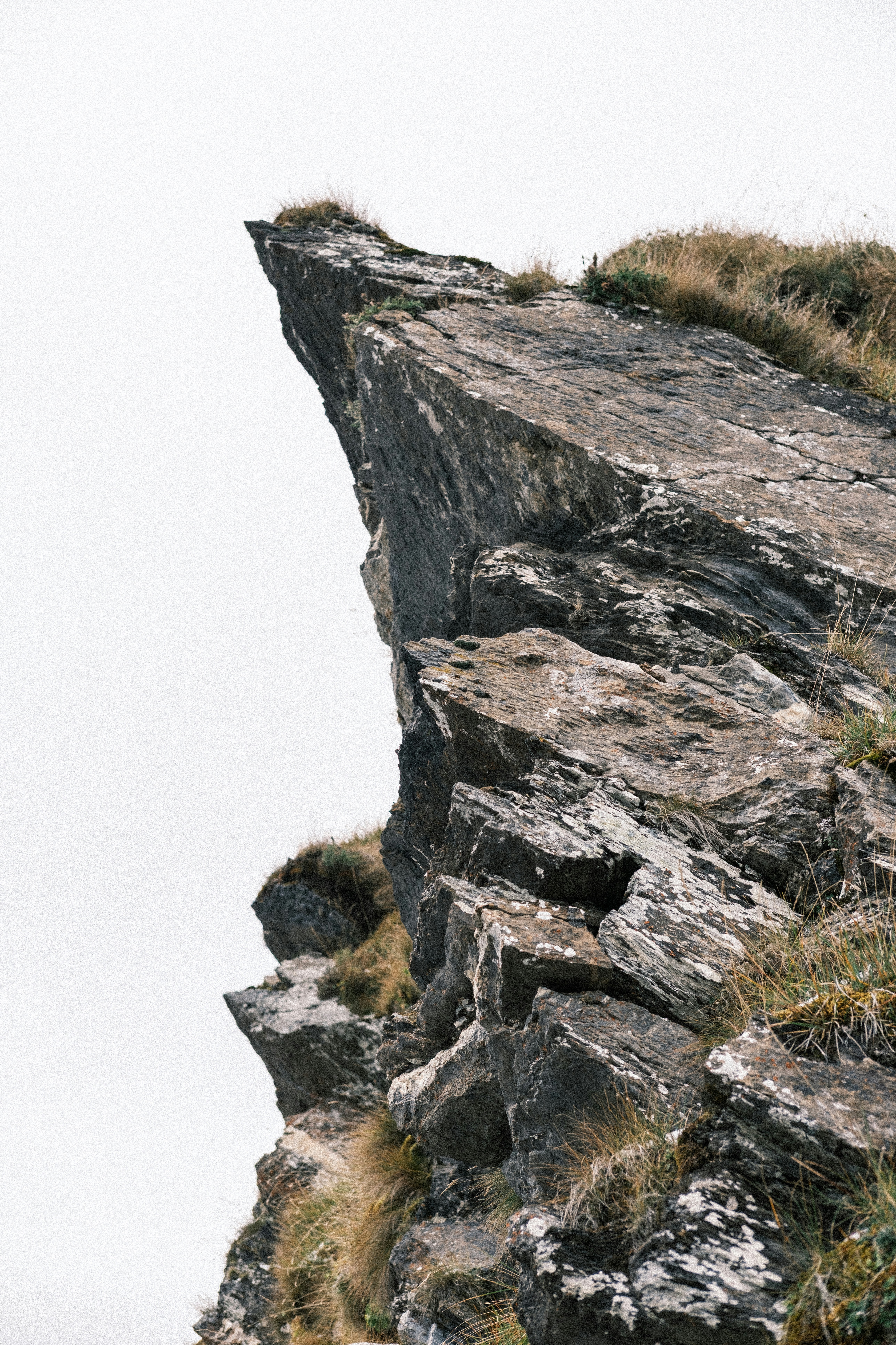 Edge of the World: A Weathered Cliff Reaches for the Mist