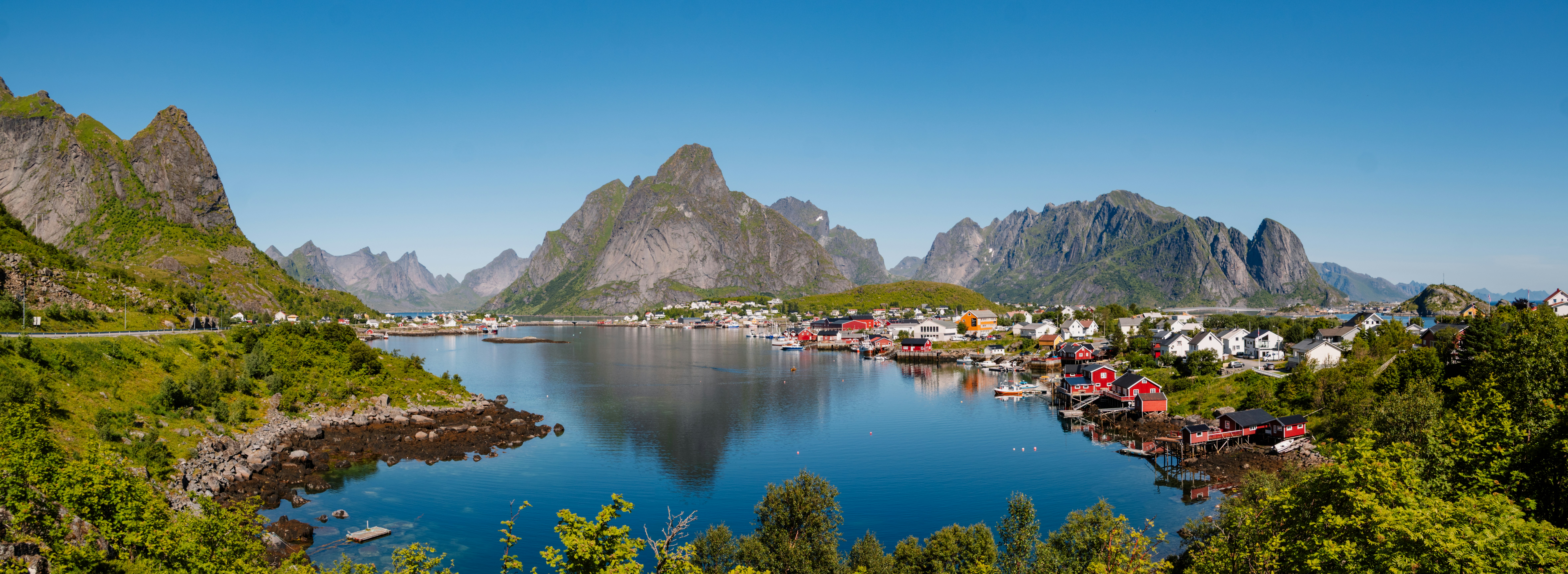 Village Reflections under Alpine Peaks