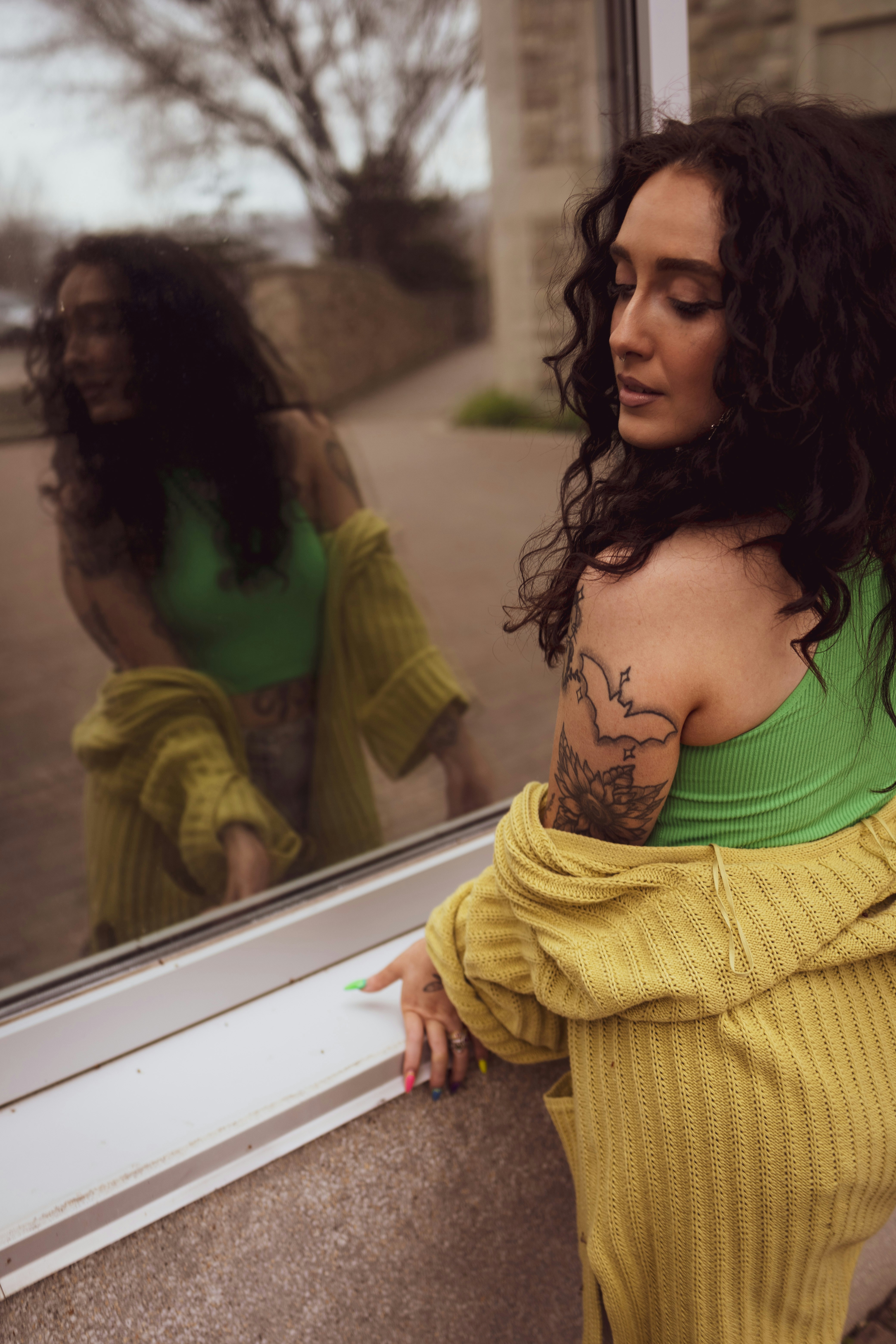 Green Top, Yellow Cardigan: A Quiet Moment by the Window