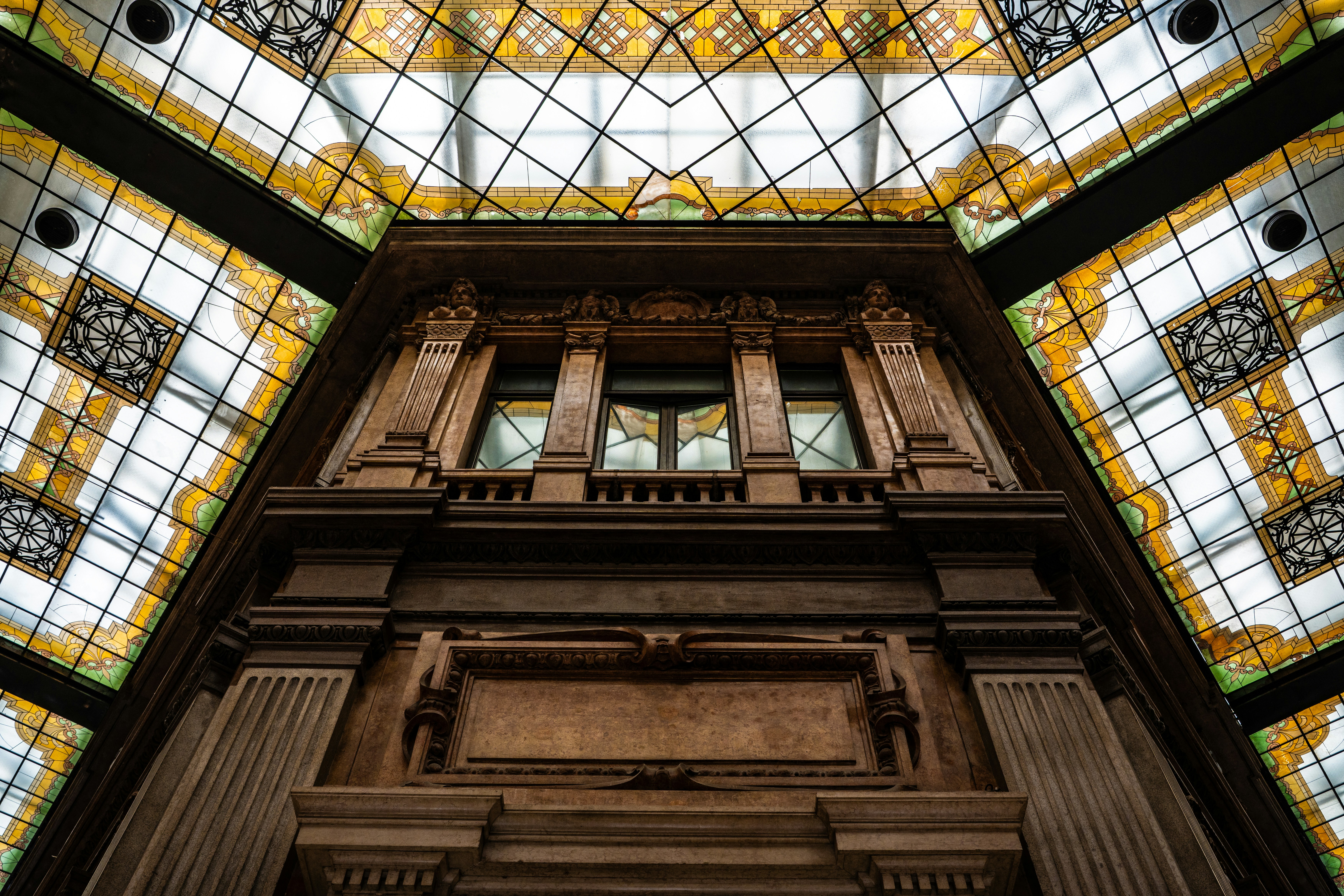 Gateway to stained-glass ascent: a monumental interior framing