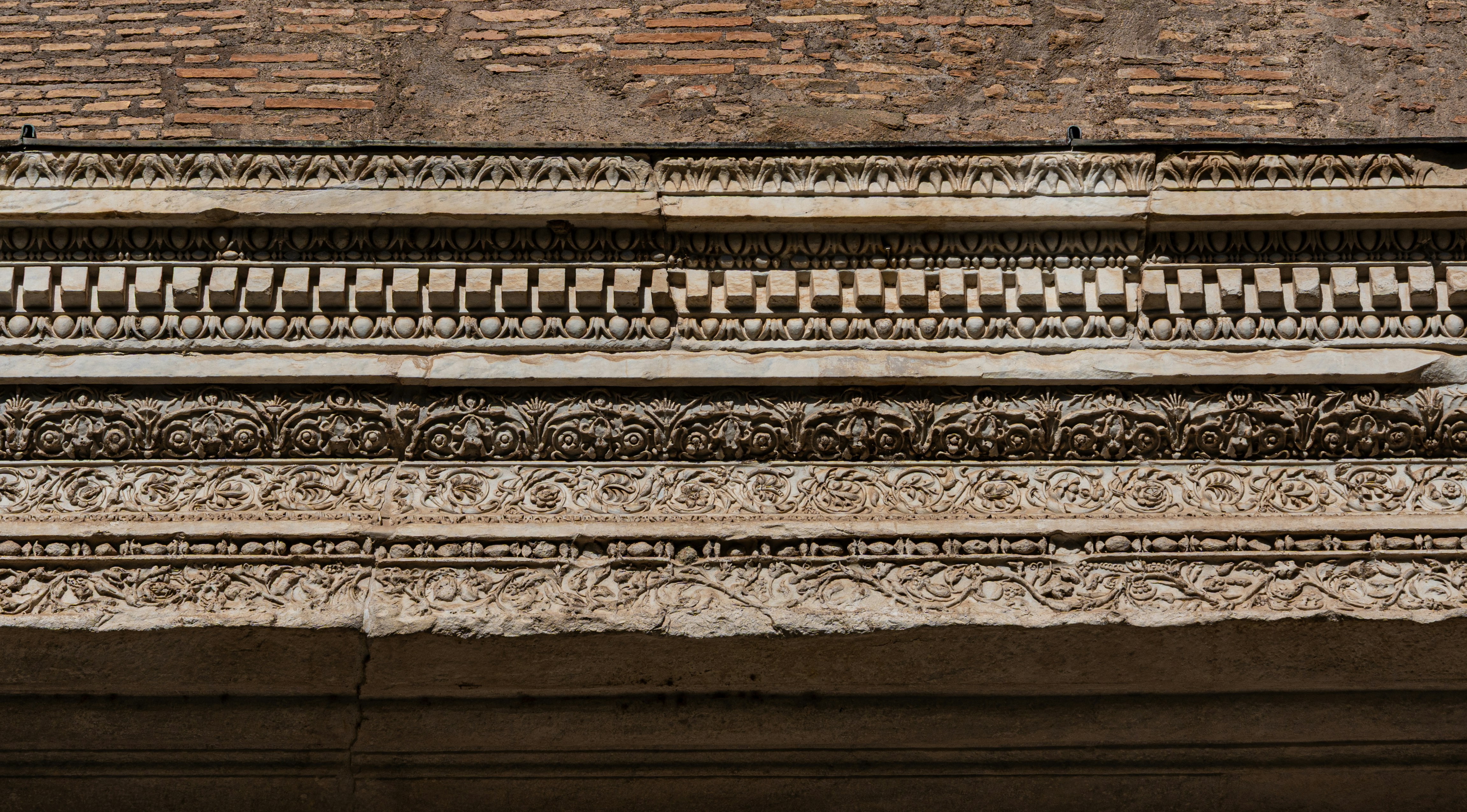 Carved Friezes: Weathered Stone Story on a Historic Facade