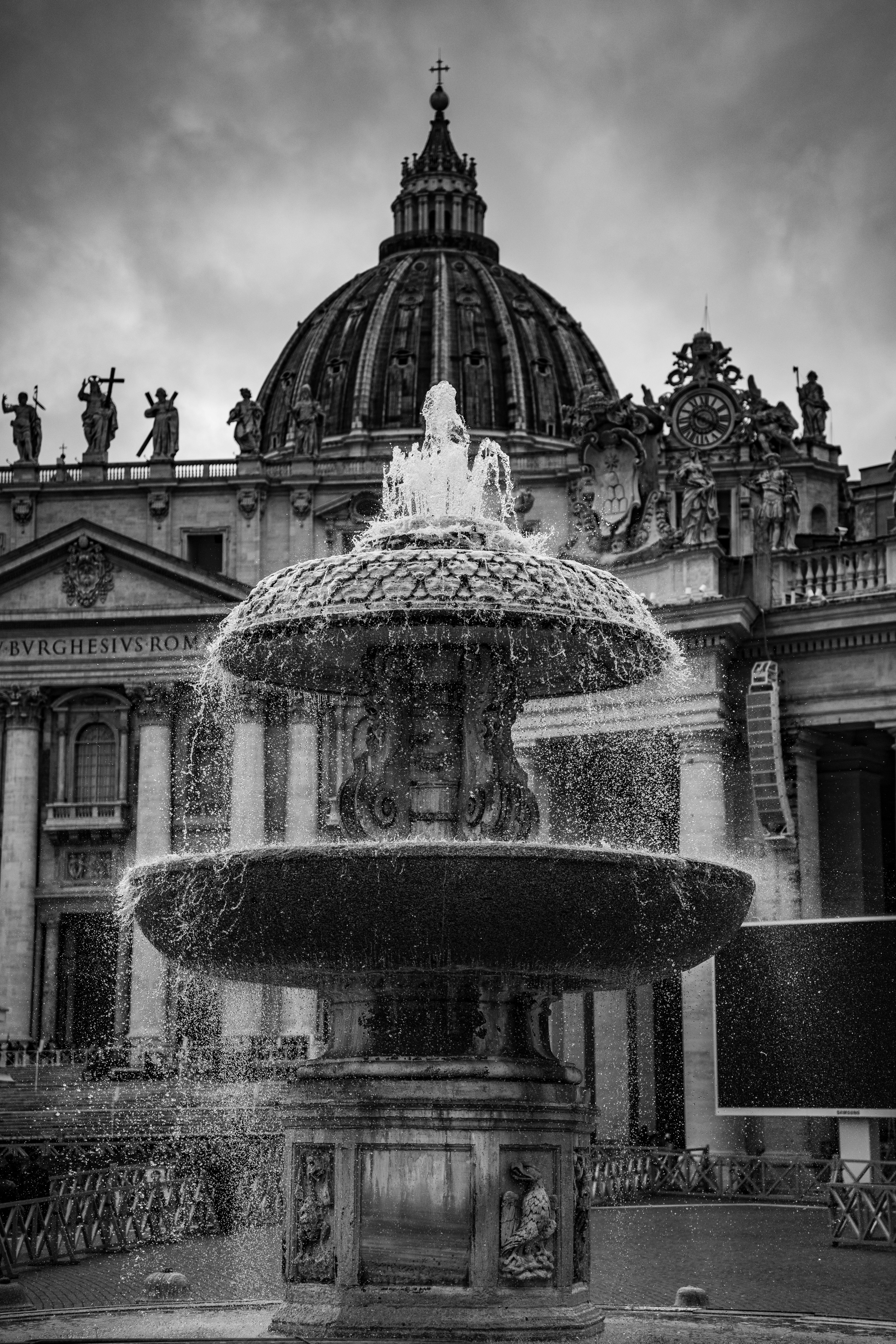 Fountain in Stately Backdrop: Rome’s Dome and Sculpted Guardians