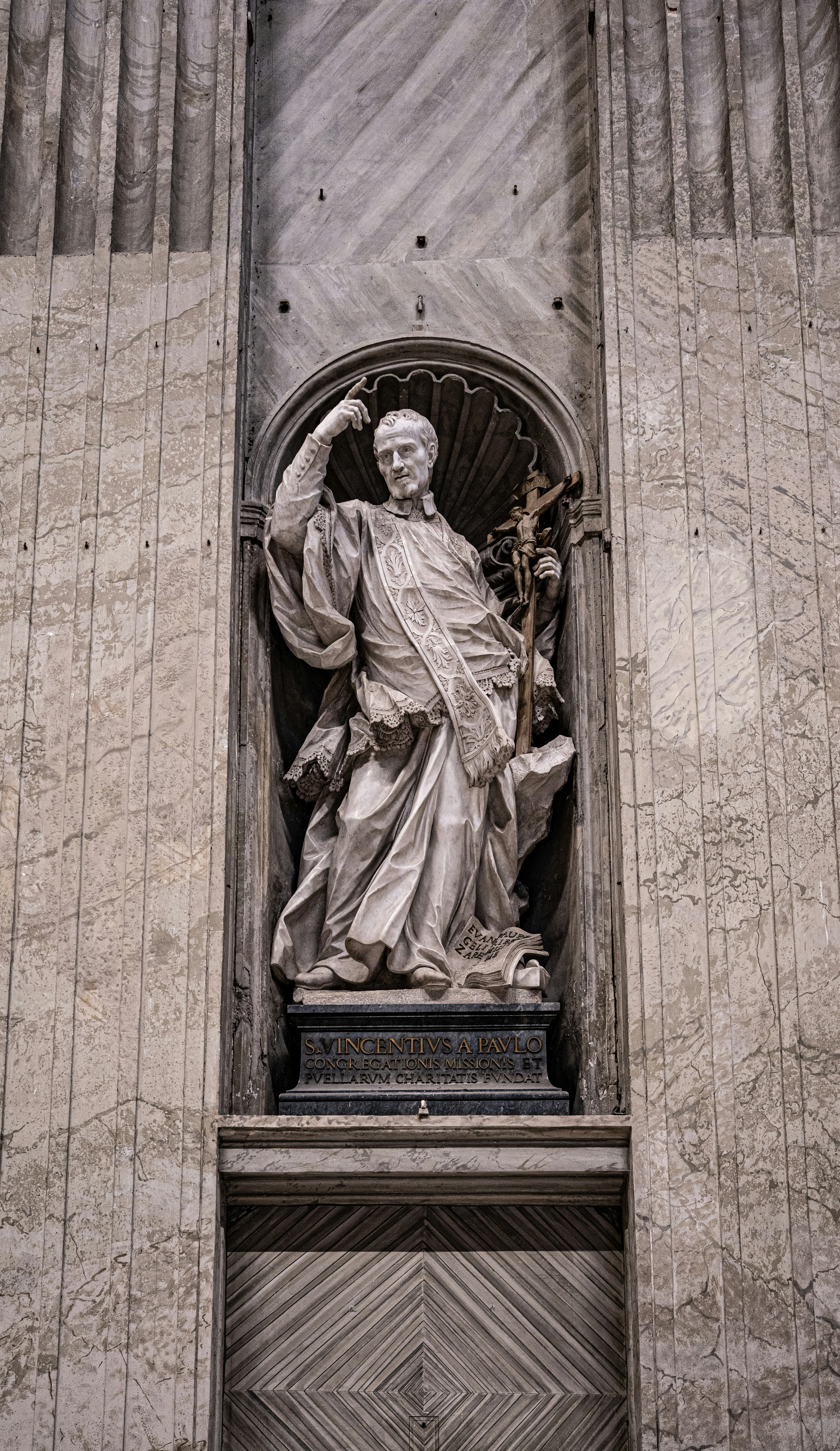Saintly Stance: A sculpted figure in a marble niche