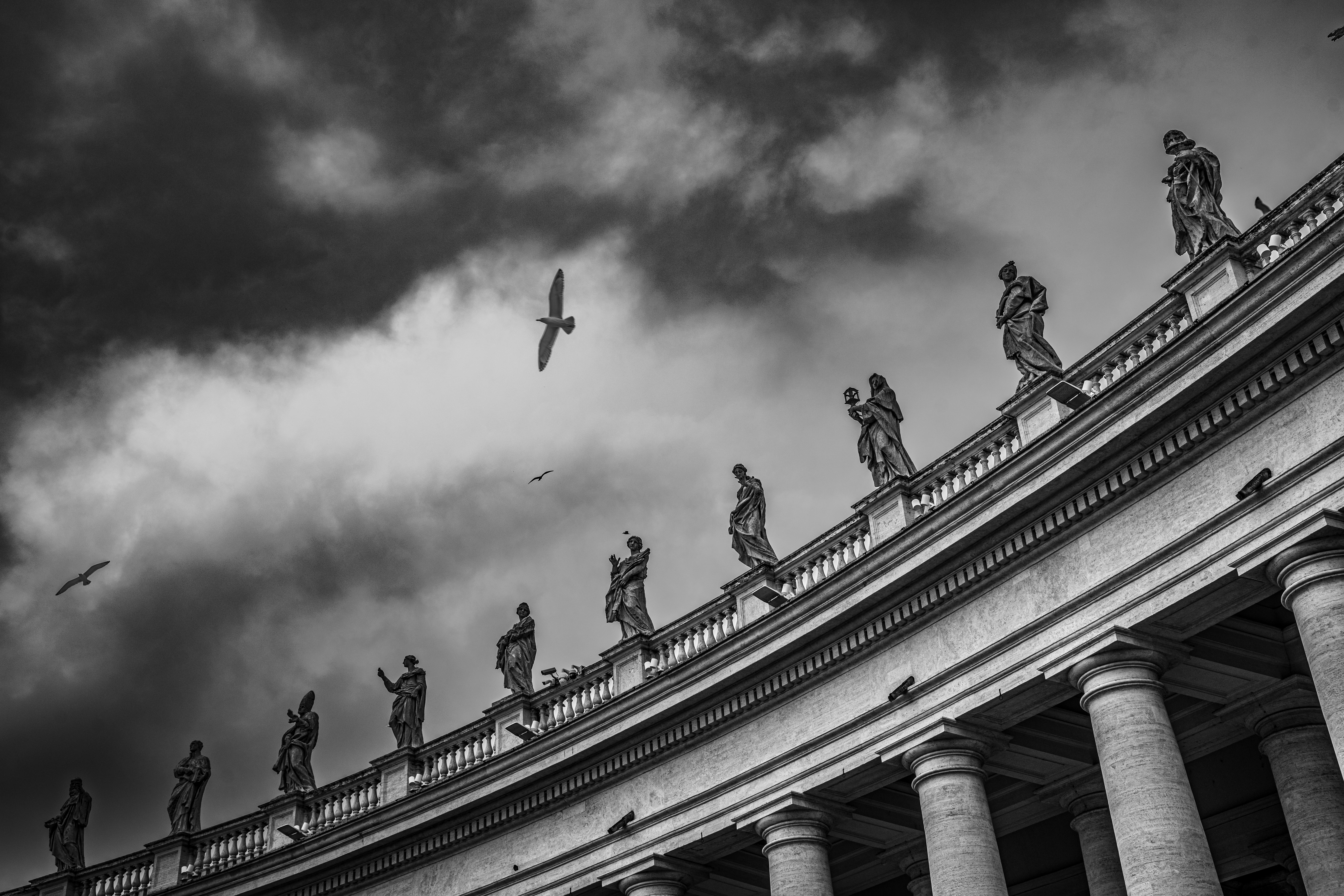 Statues on the Curved Frieze: A Monumental Skyline in Monochrome