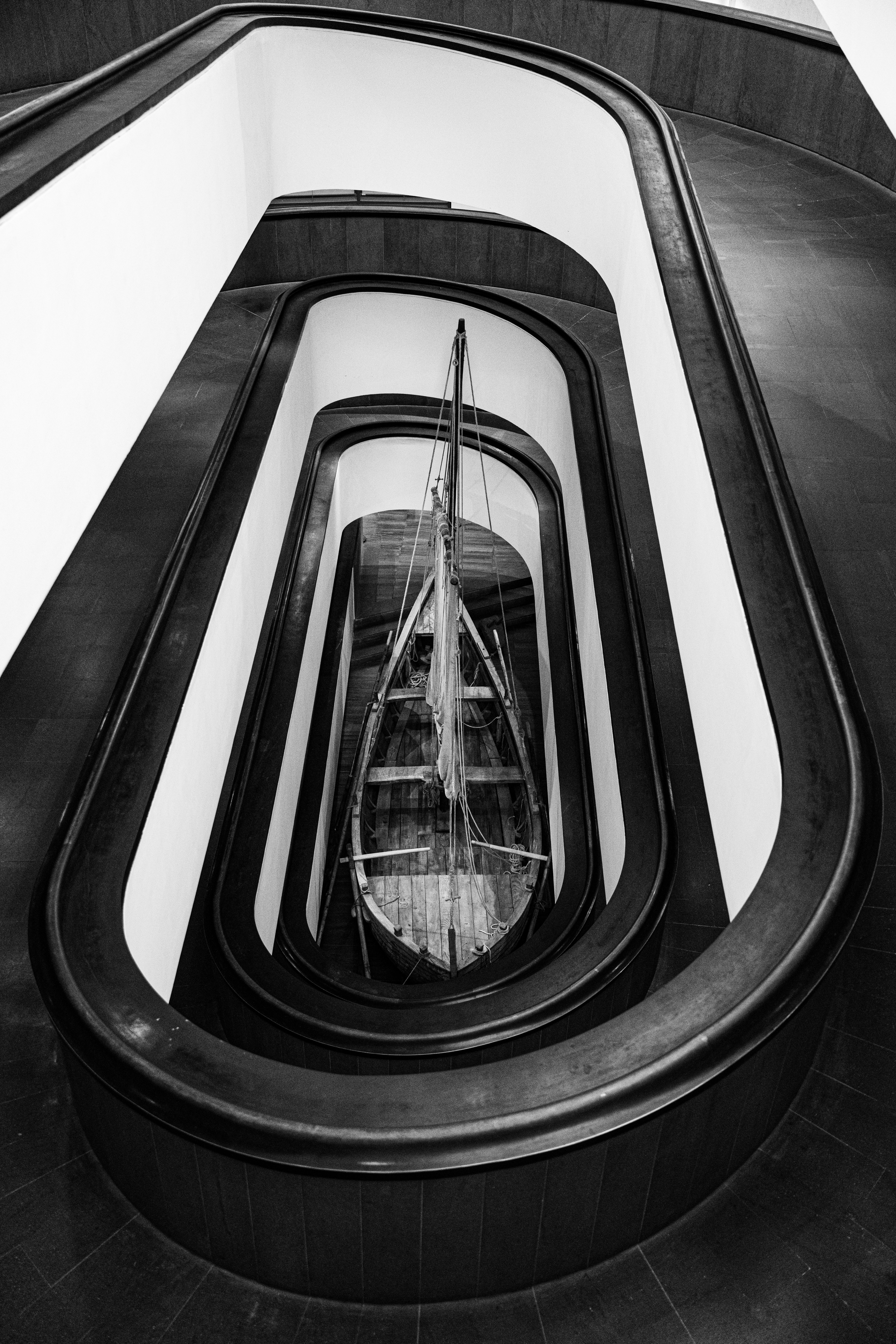 Spiral Descent: An Abandoned Boat Captured in Abstract Stairwell Geometry