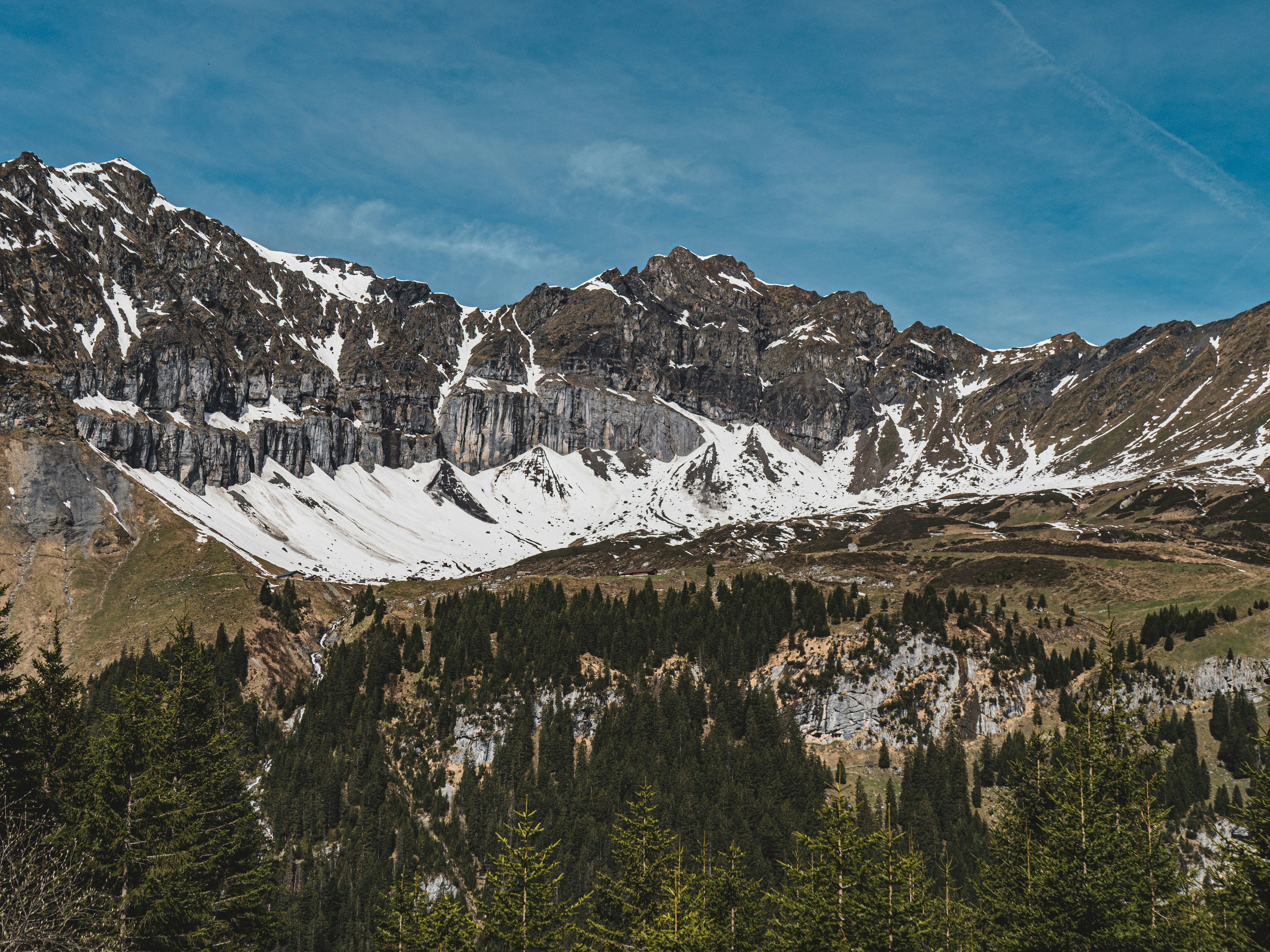 Snow-line Cathedral: A Mountain Ridge Under Clear Dawn Sky