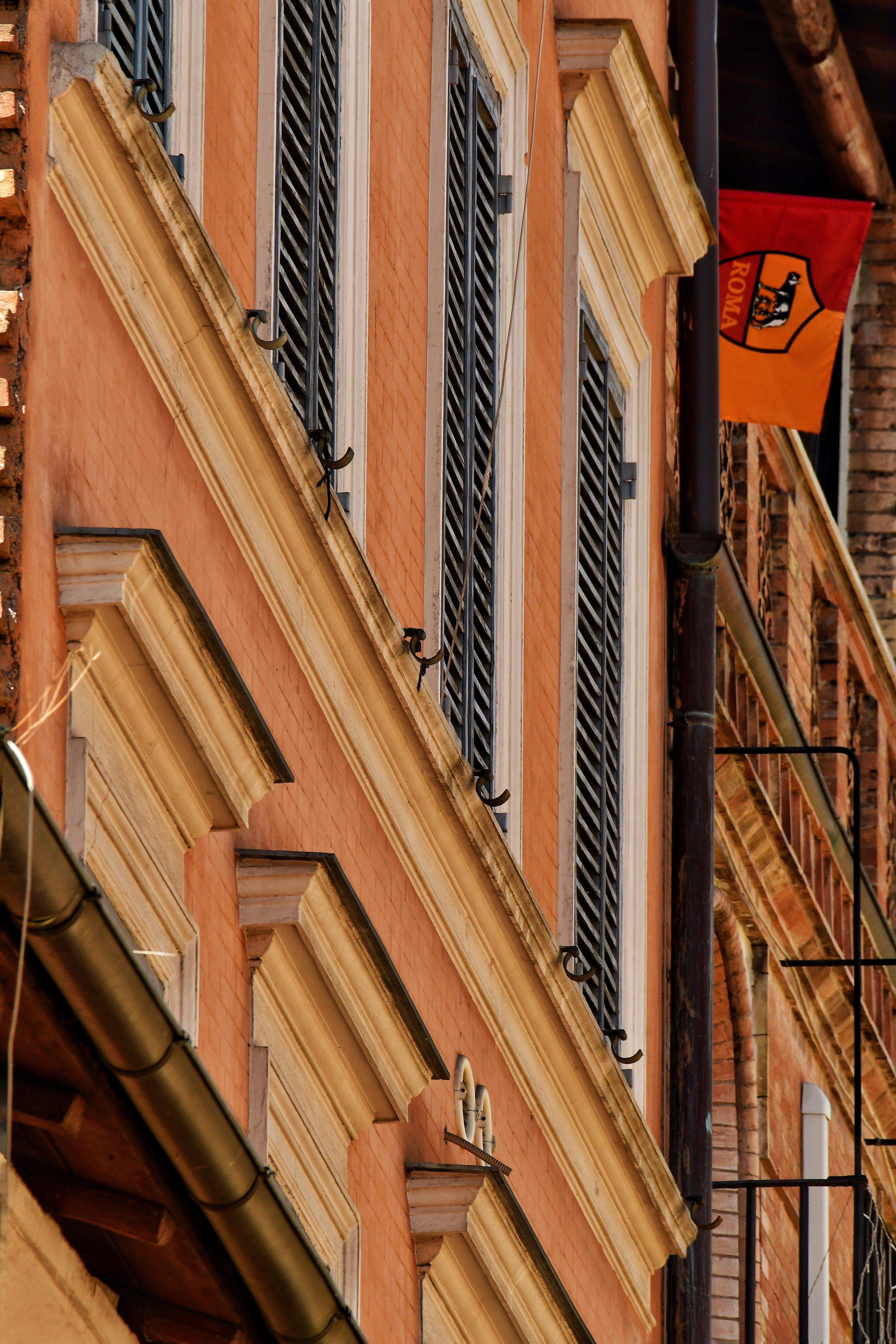 Warm Facade Lines: A Venetian-Orange Street Portrait